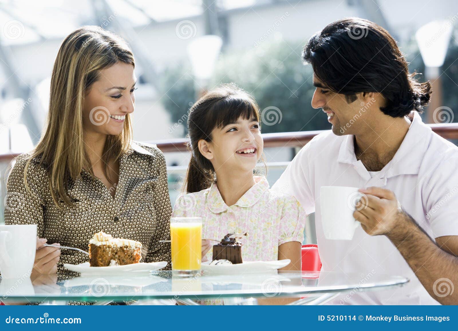 Family Enjoying Snack at Cafe Stock Photo - Image of food, cute: 5210114