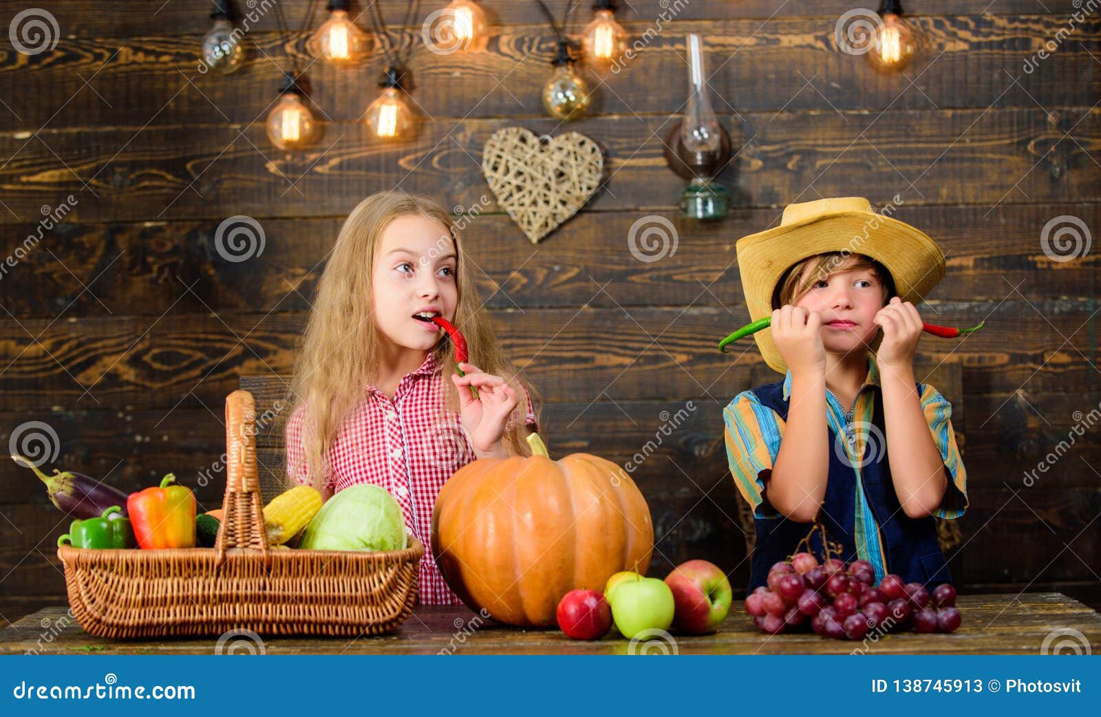 Family Farm. Children Presenting Farm Harvest Wooden Background ... Family Farm. Children Presenting Farm Harvest Wooden Background ...