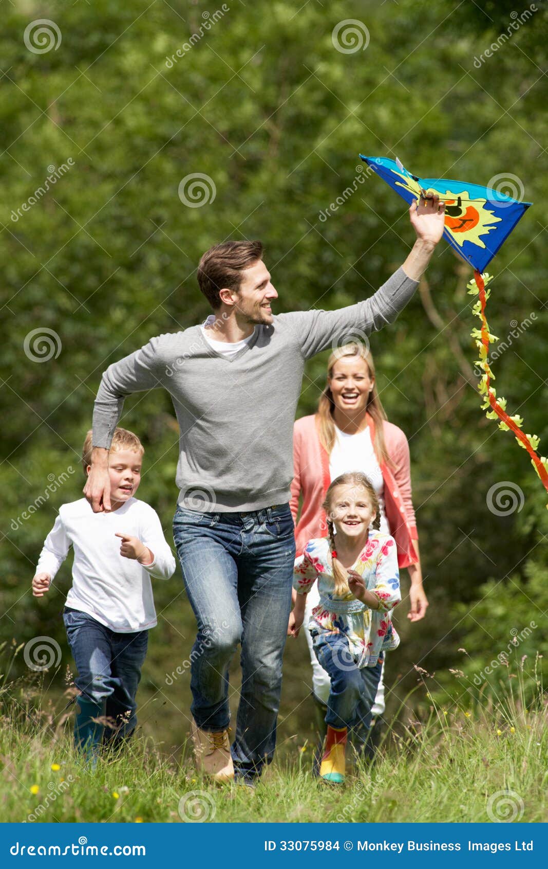 Family Flying Kite in Countryside Stock Photo - Image of flying, four ...