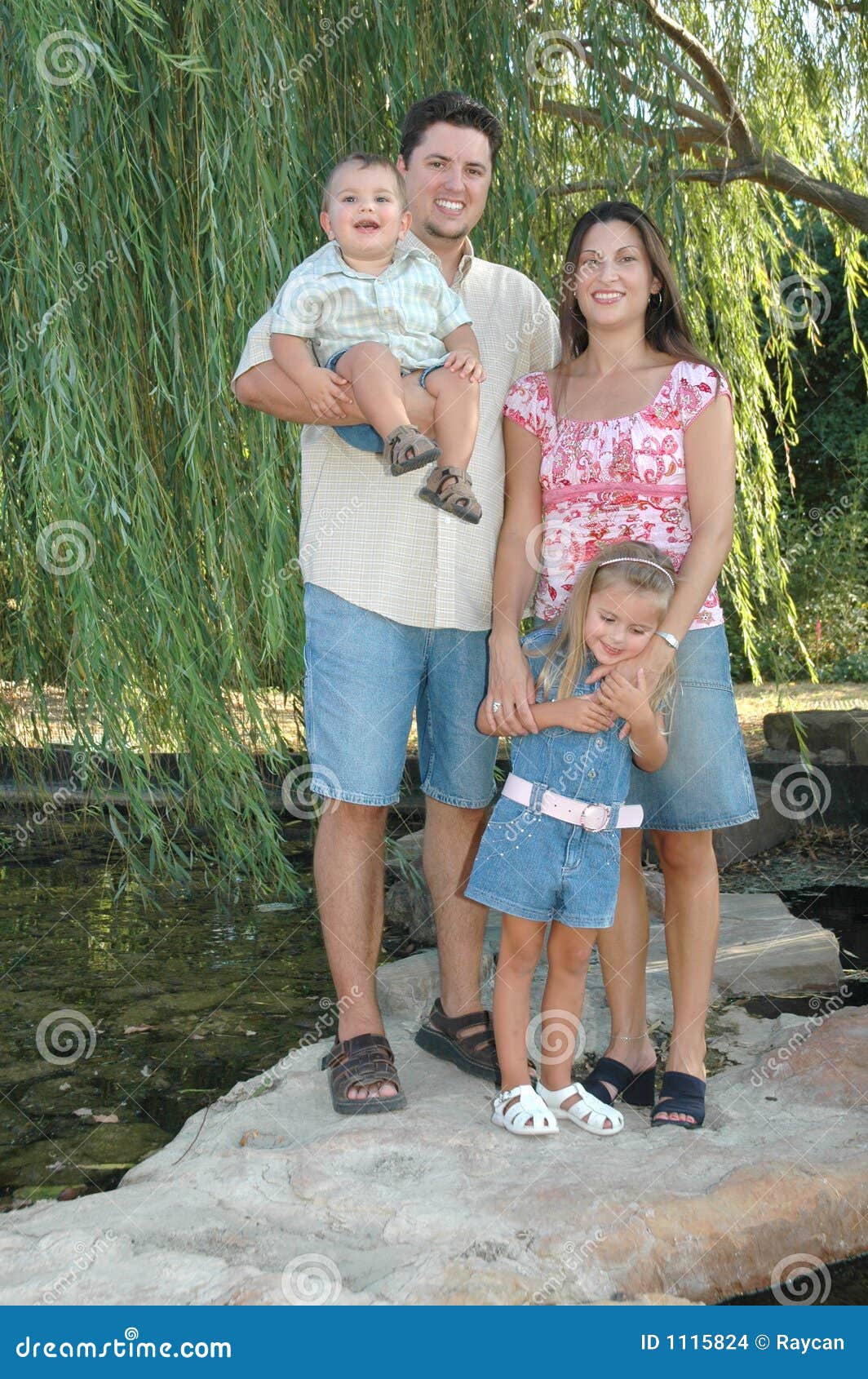 Family of four stock photo. Image of hugs, fashion, joyful - 1115824