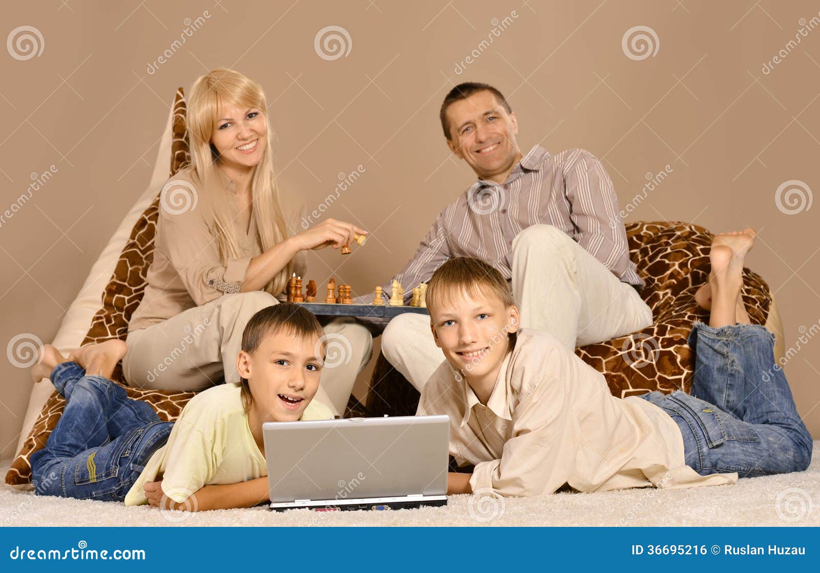 Family of four having fun stock photo. Image of cushion - 36695216