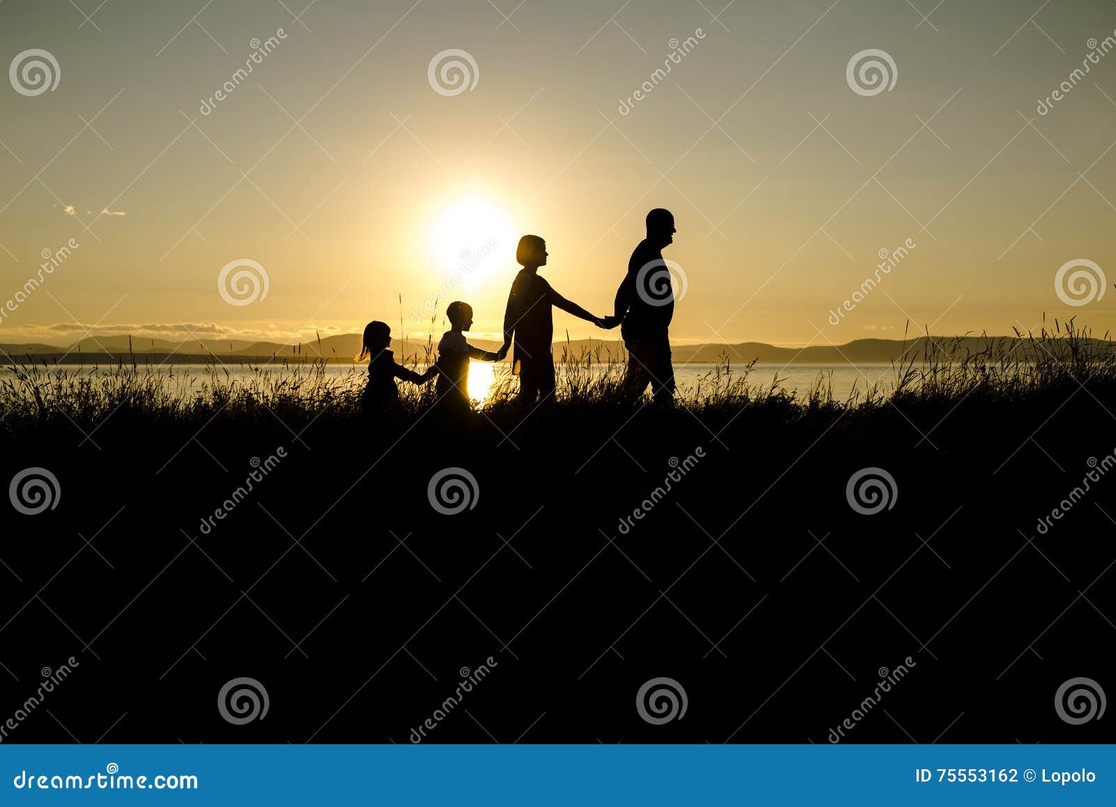 Family of Four at Sunset Shadow Black Backlit Stock Photo - Image of ...