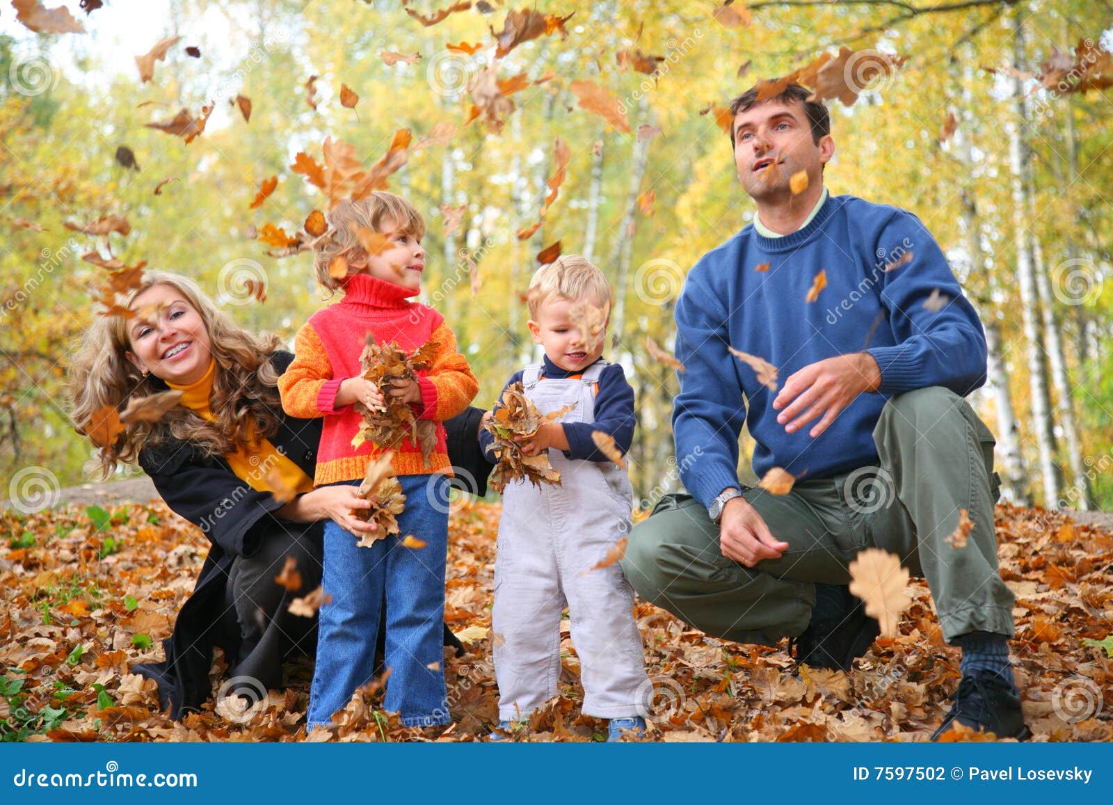 Family of Four Throw Autumnal Leaves Stock Photo - Image of coat, laugh ...