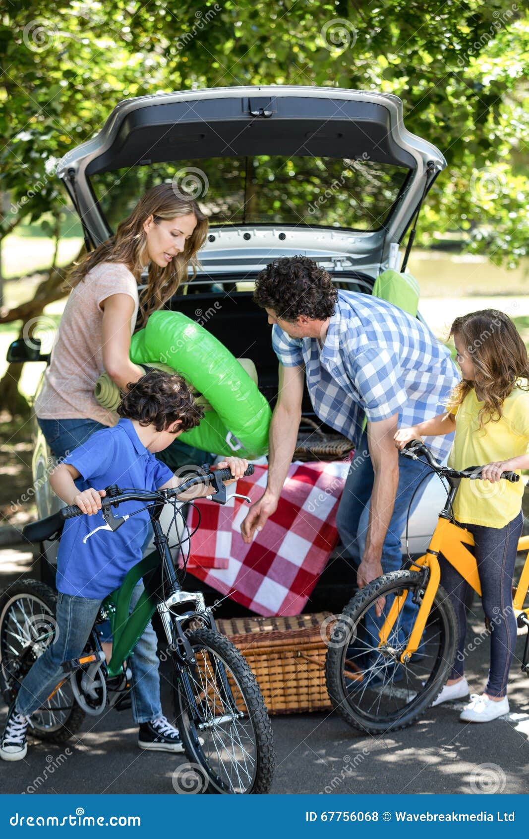 Family in front of a car stock photo. Image of nature - 67756068