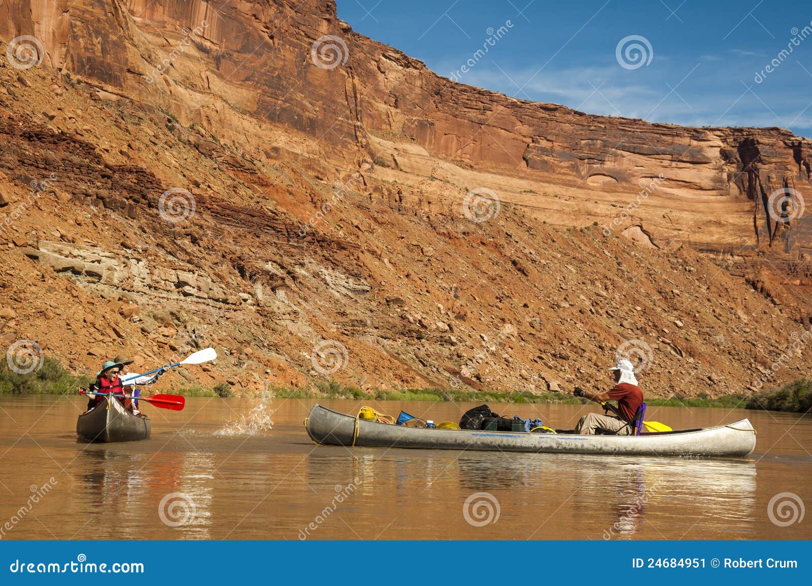 Family Fun on Desert River in Canoes Stock Image - Image of butte ...
