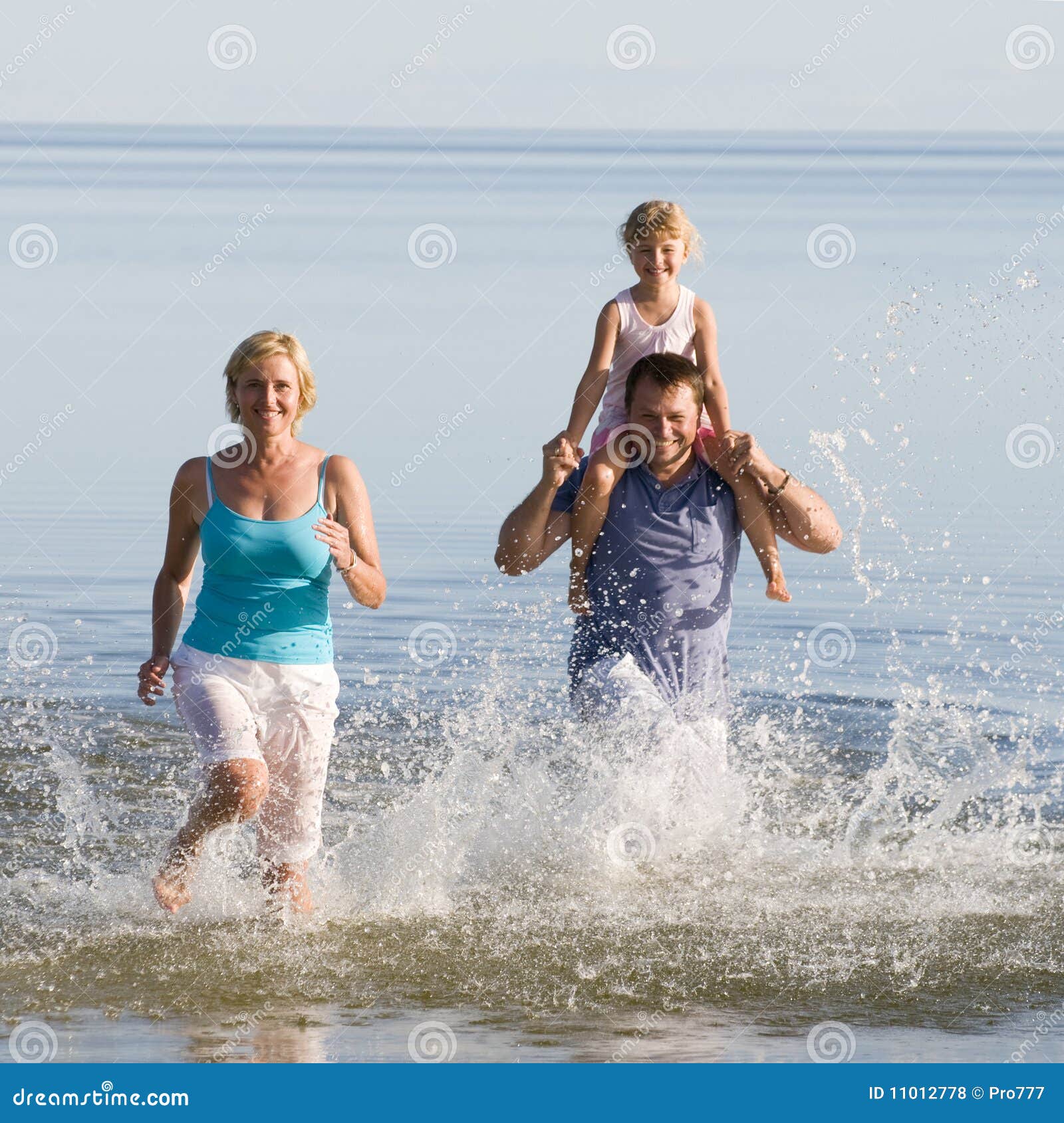 Family fun,sea and sun stock photo. Image of parenthood - 11012778