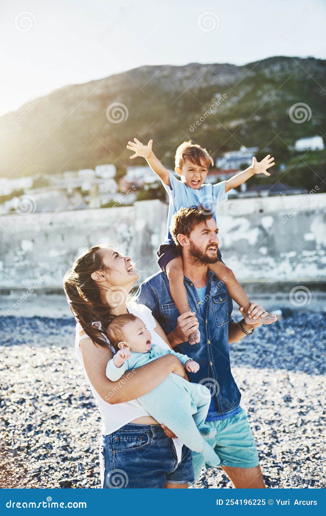 Family Fun Time at the Beach. a Young Family Spending Quality Time at ...