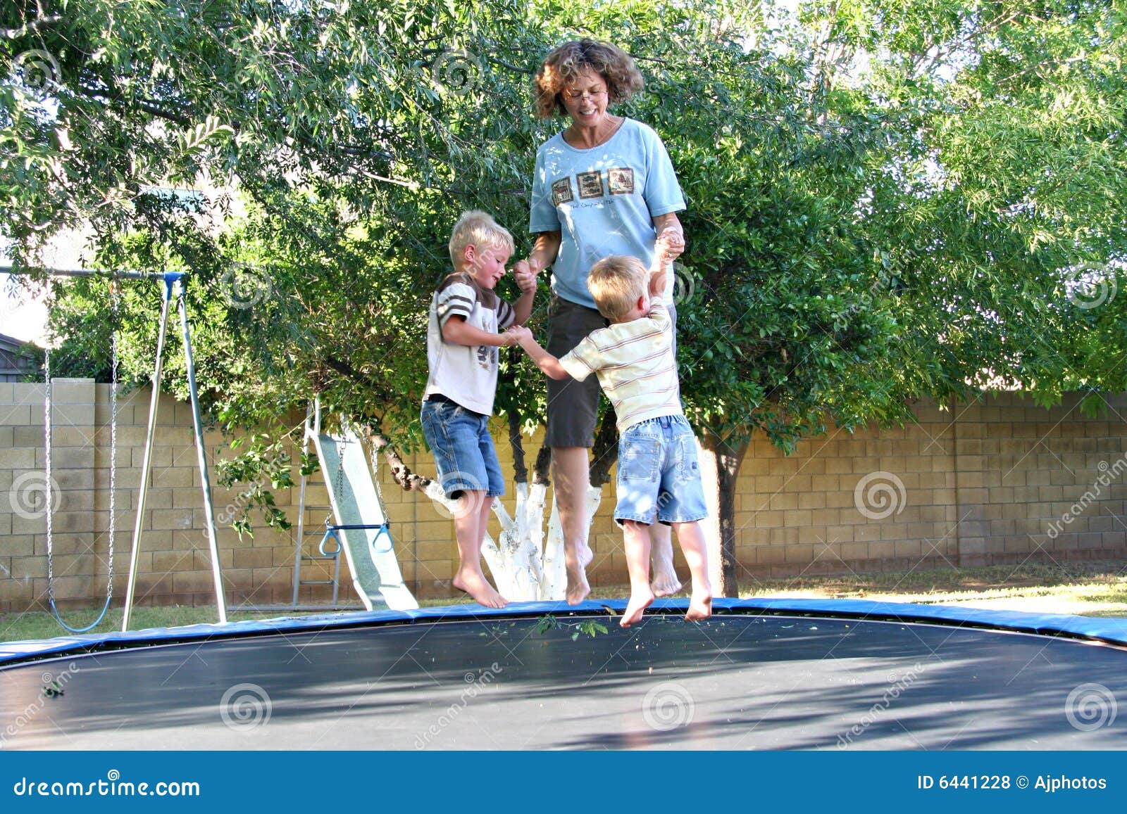Family Fun on the Trampoline Stock Photo - Image of outside, enthusiasm ...