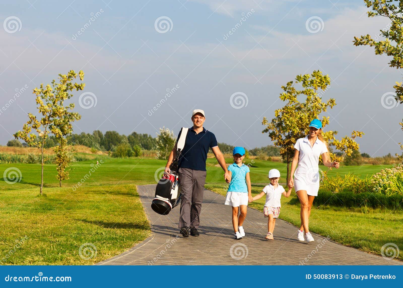 Family of golf players stock image. Image of casual, game - 50083913