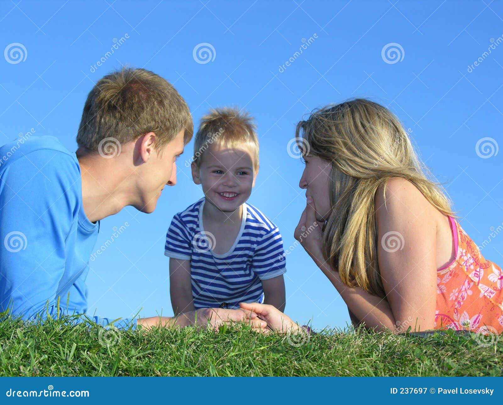 Family on grass faces stock image. Image of parenthood - 237697