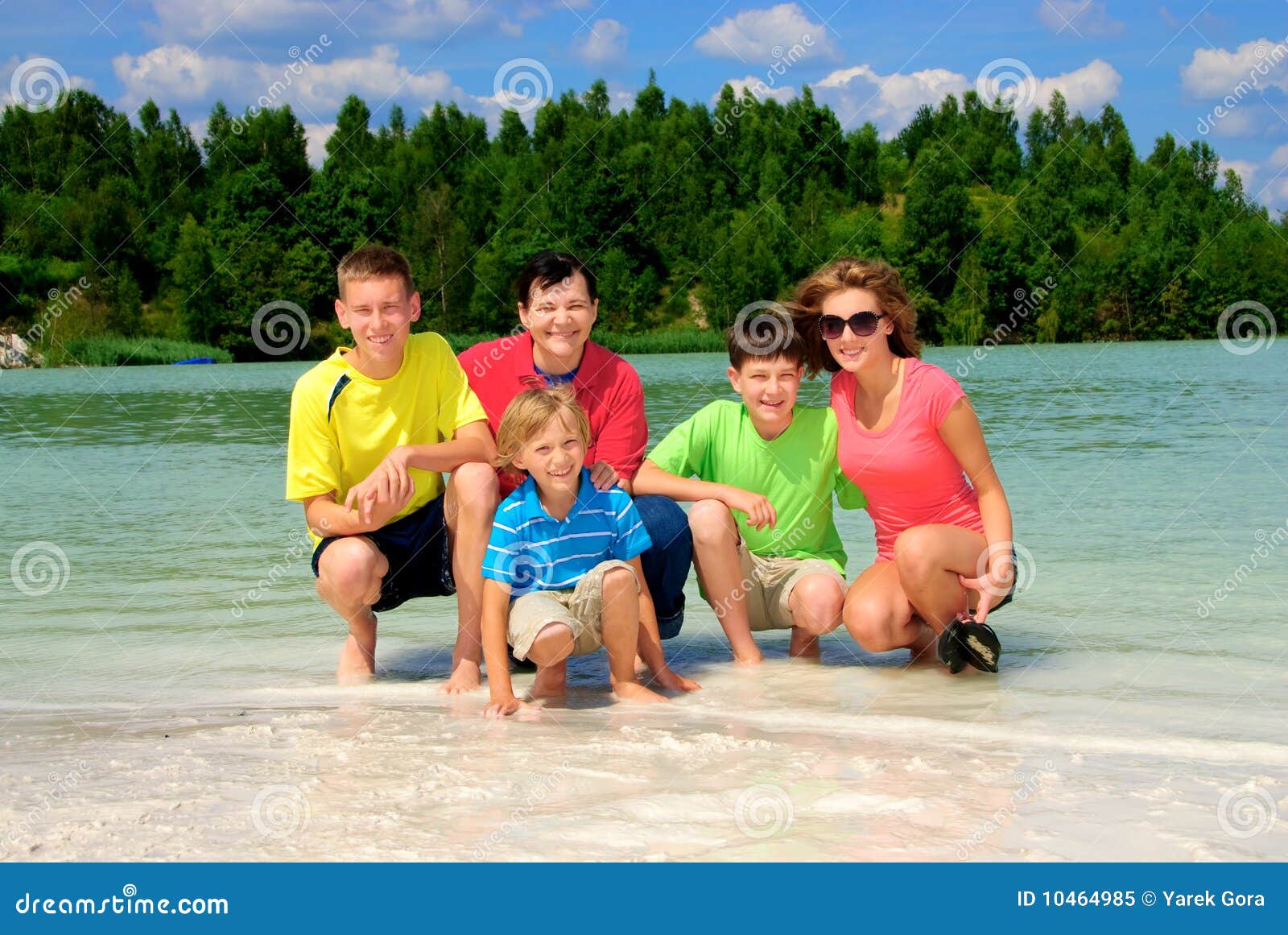 Family by green lake stock image. Image of blue, clear - 10464985