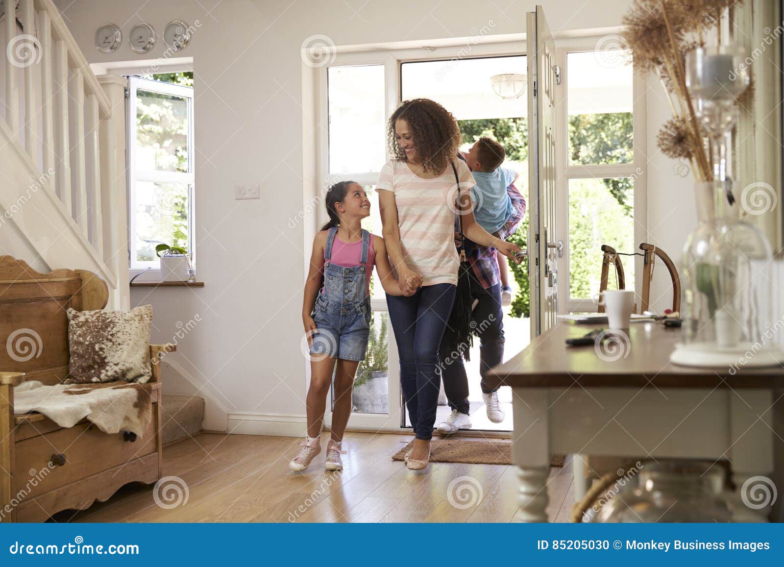 Family in Hallway Returning Home Together Stock Photo - Image of child ...