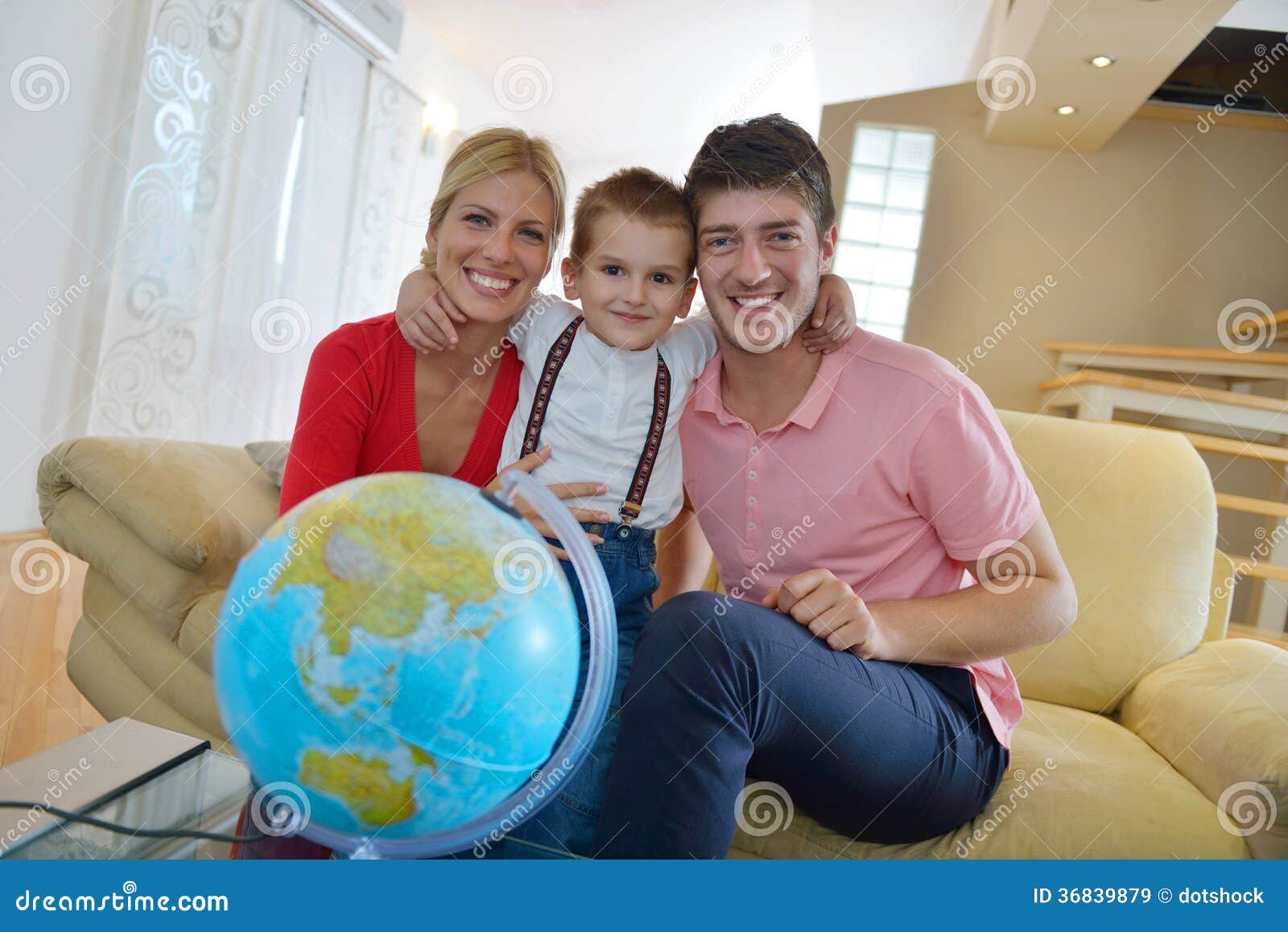 Family have fun with globe stock image. Image of blonde - 36839879