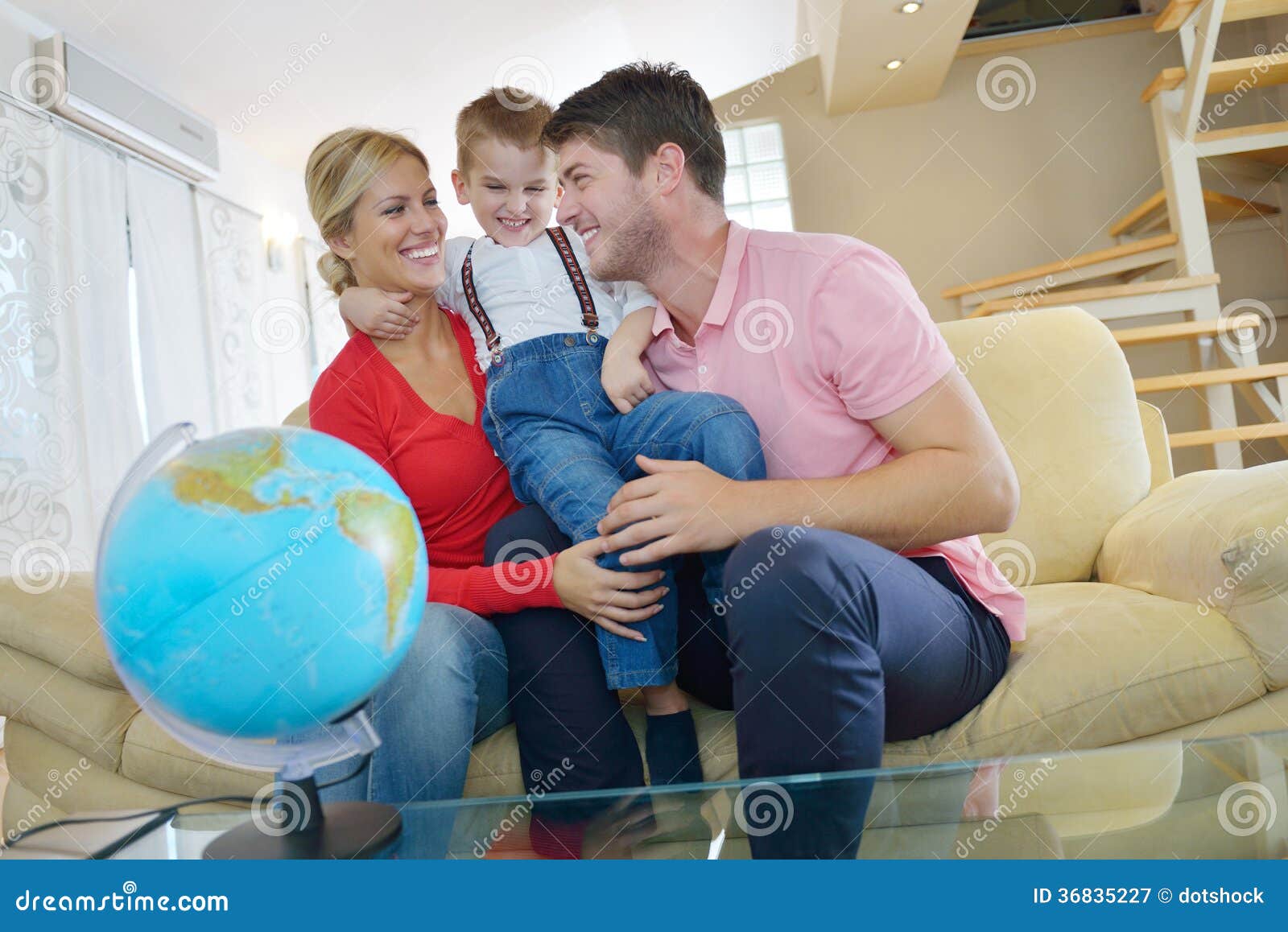 Family have fun with globe stock image. Image of blonde - 36835227