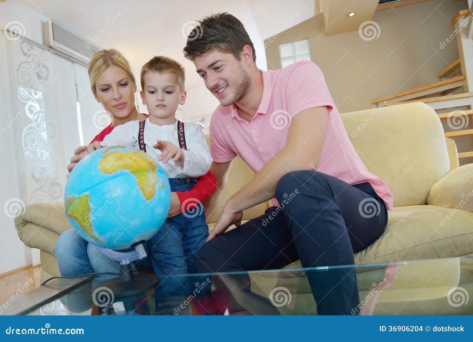 Family have fun with globe stock photo. Image of couple - 36906204