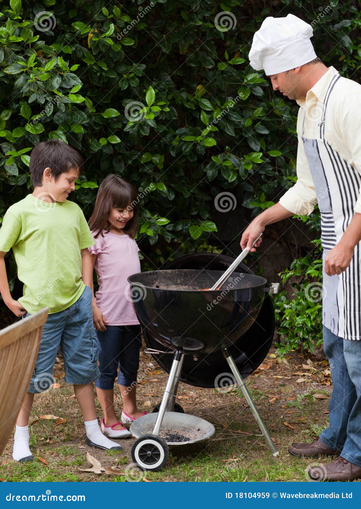 Family Having a Barbecue in the Garden Stock Image - Image of house ...