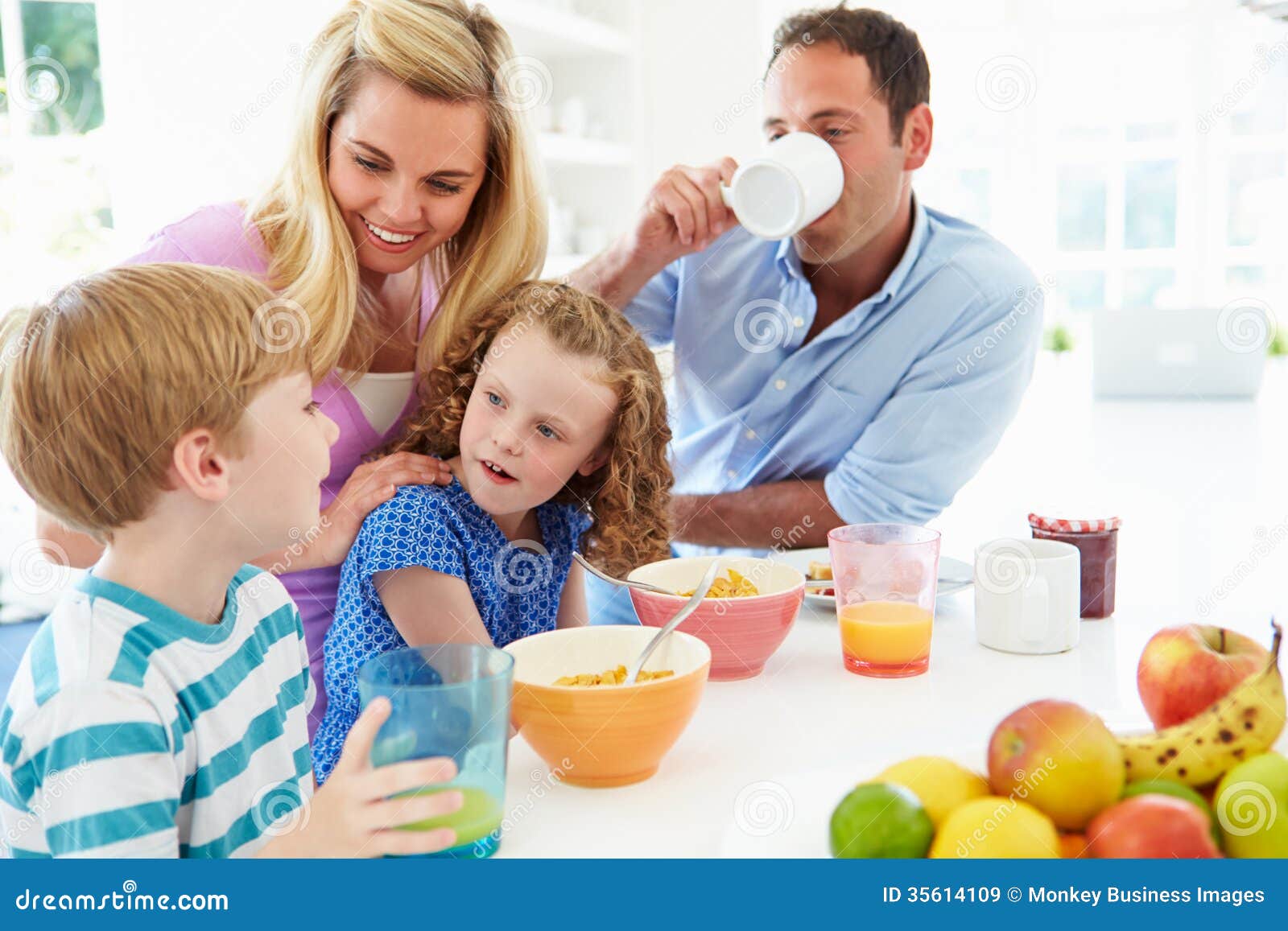 Family Having Breakfast in Kitchen Together Stock Image - Image of ...
