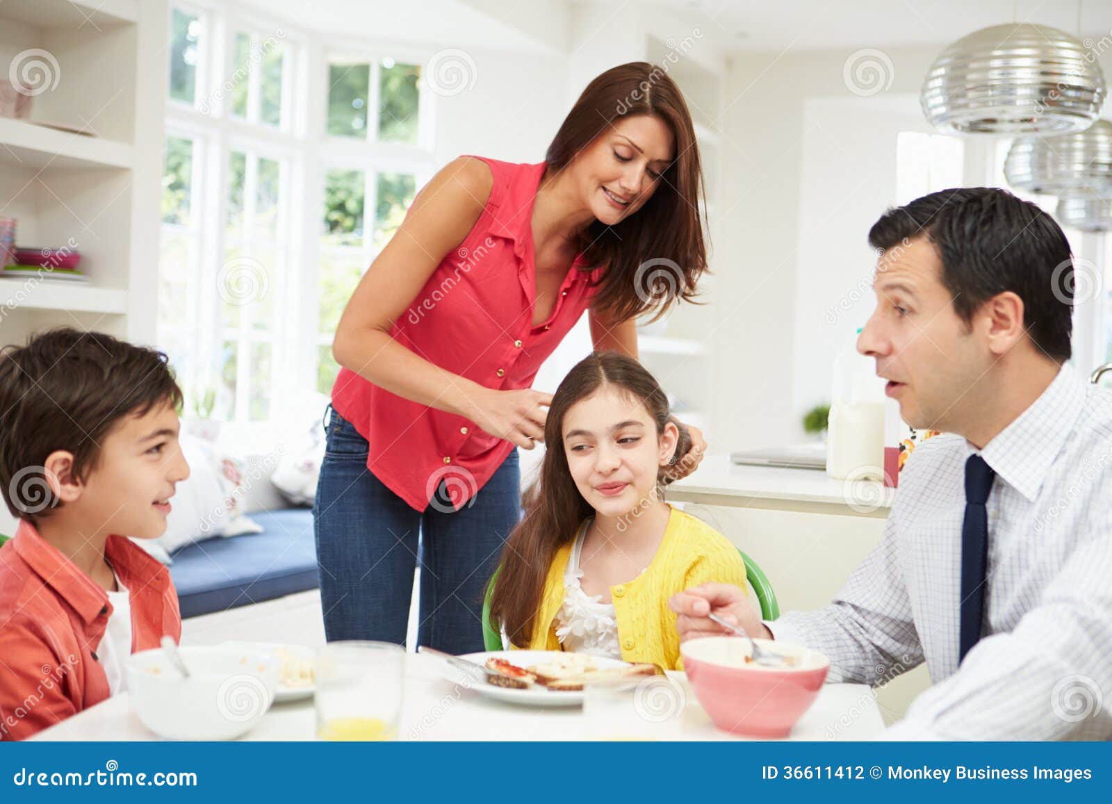Family Having Breakfast before Work Stock Photo - Image of male, mixed ...