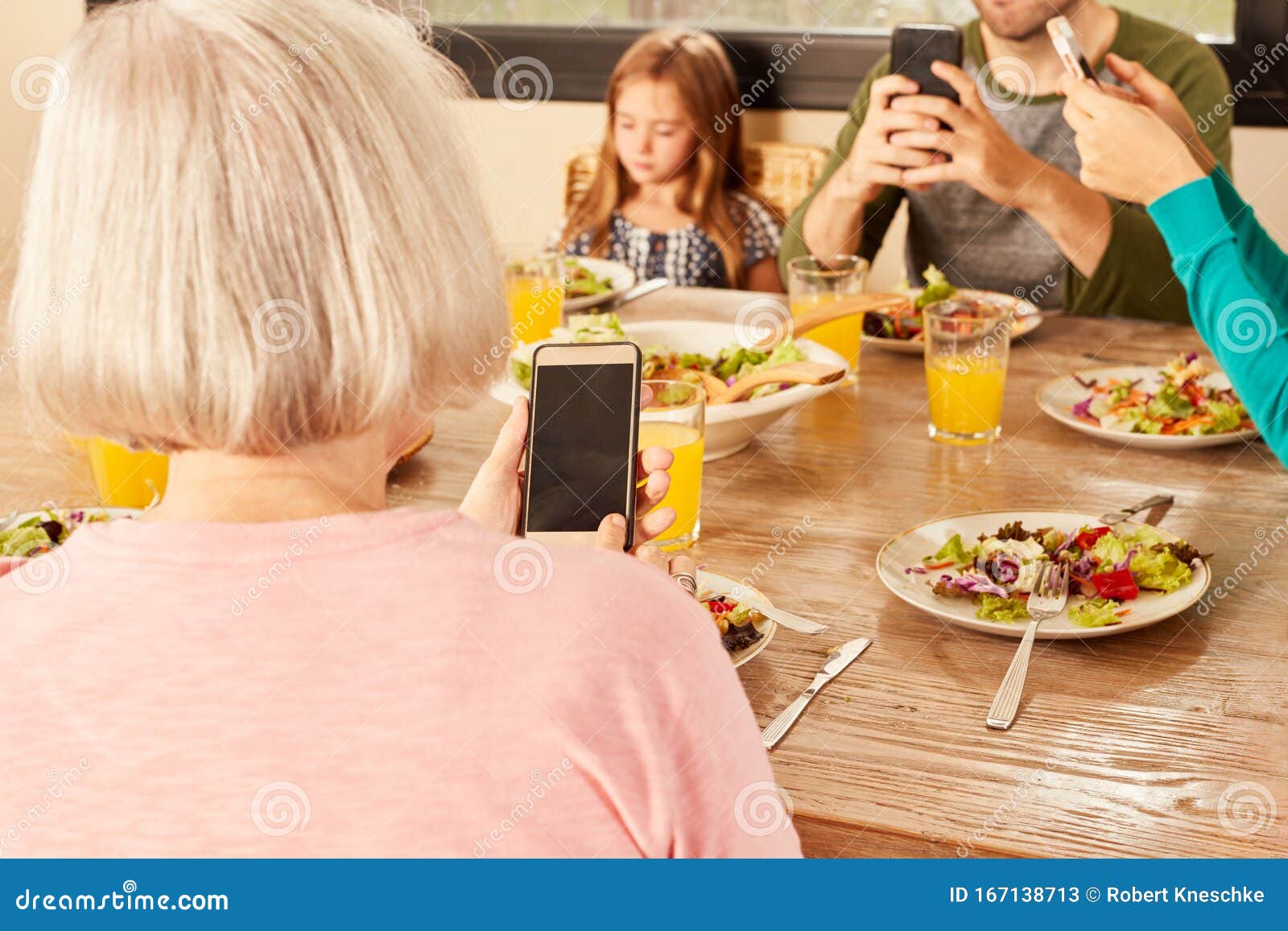 Family Having Dinner with Smartphone and Mobile Phone Stock Image ...