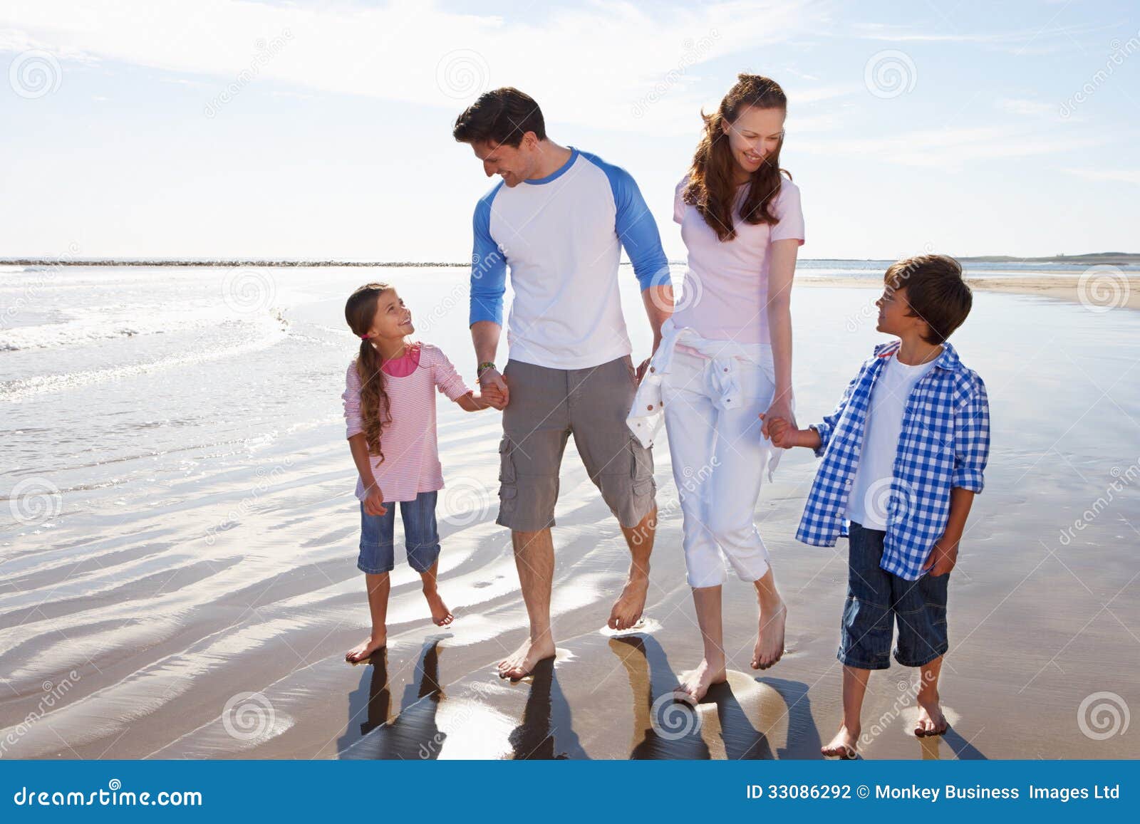 Family Having Fun on Beach Holiday Stock Photo - Image of children ...