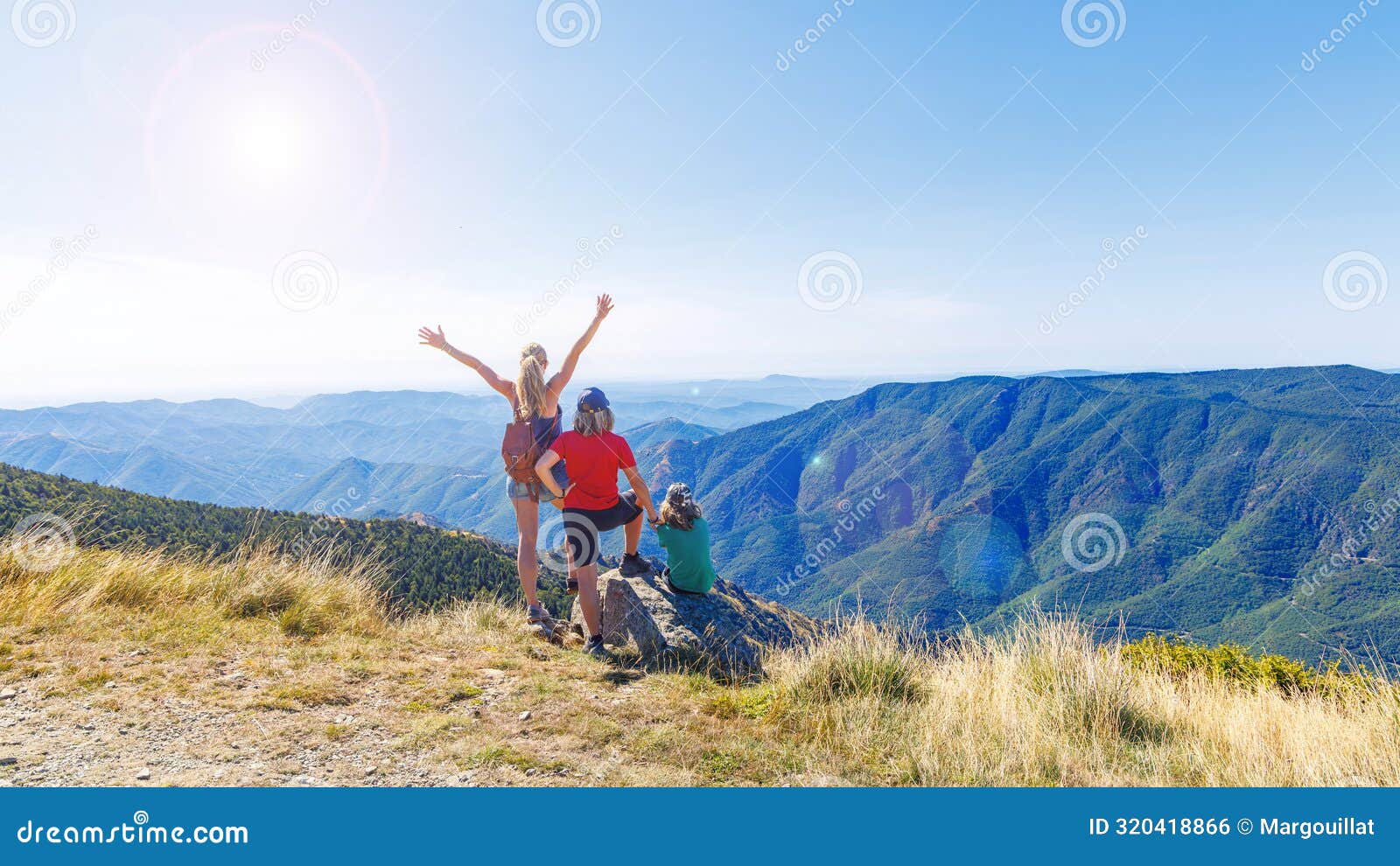 Family Having Fun and Enjoying Panoramic View of Mountain Stock Photo ...
