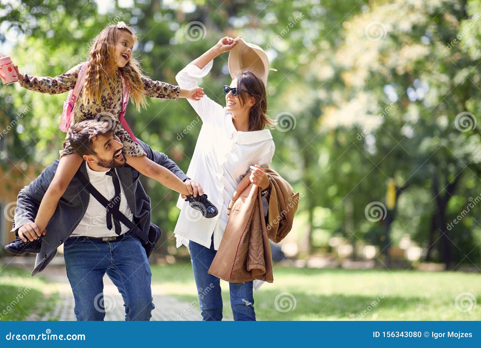 Family Having Fun in Park after School Stock Photo - Image of ...