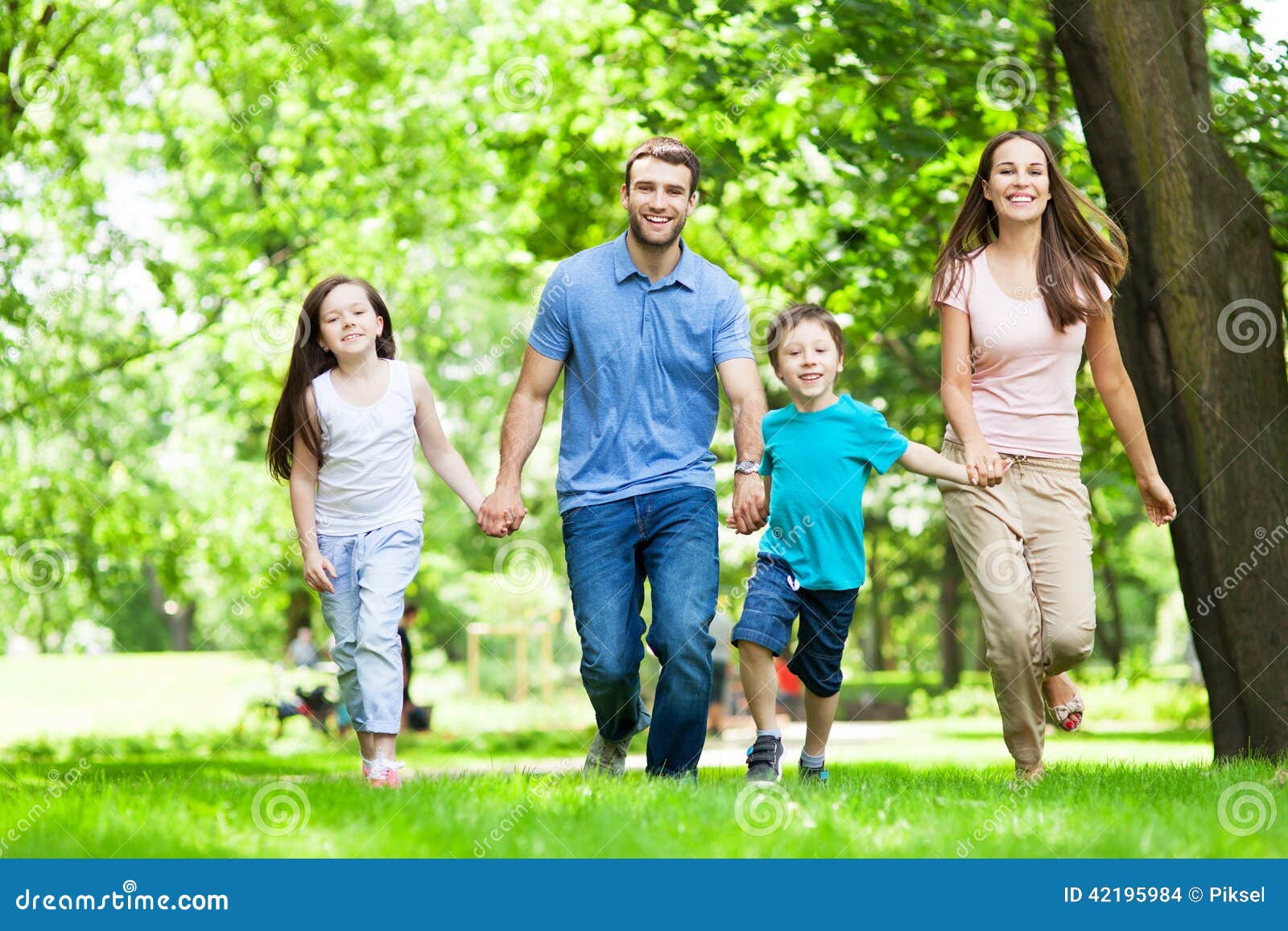 Family Having Fun in Park stock photo. Image of parent - 42195984