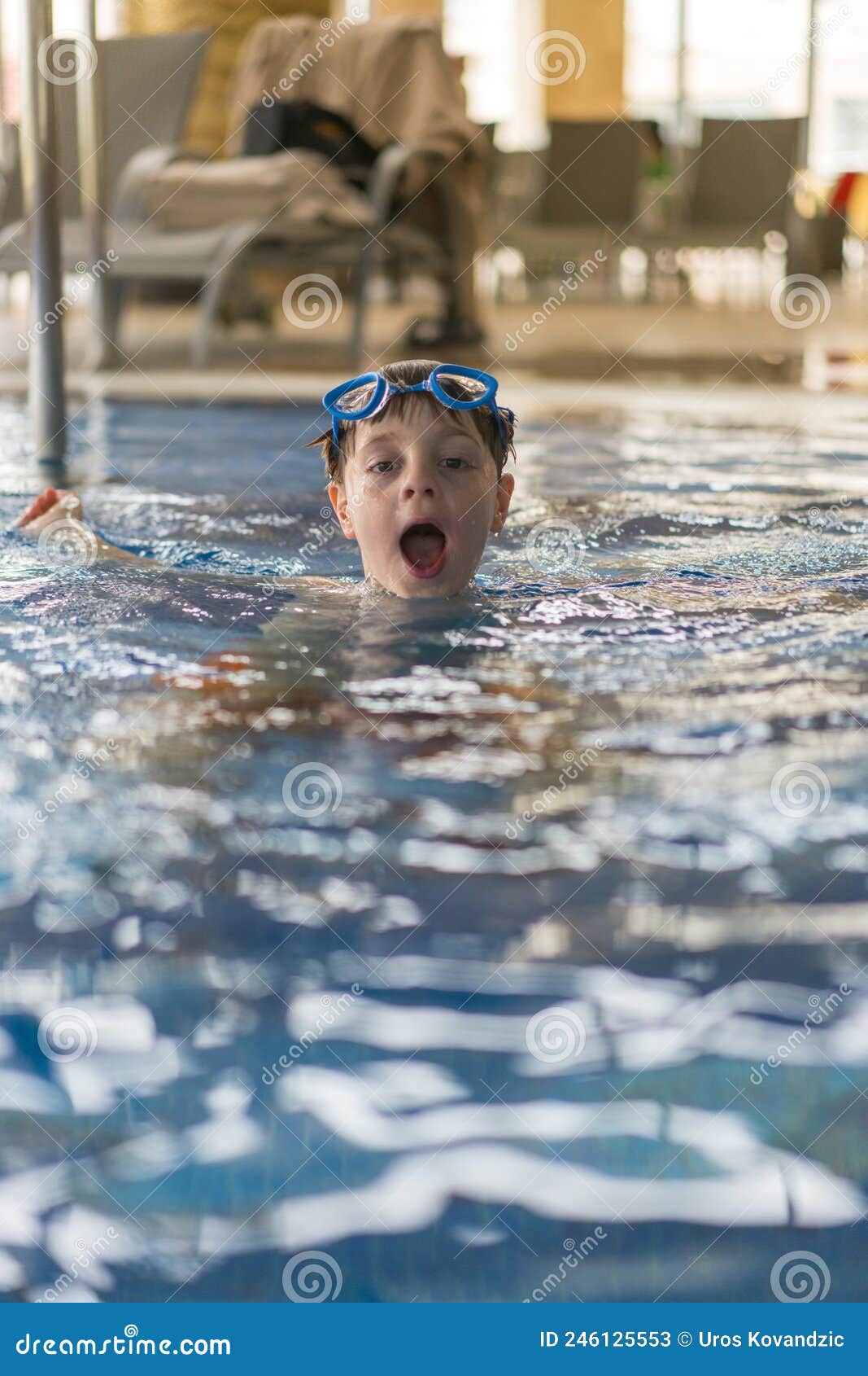 Boy having fun in pool stock image. Image of funny, young - 246125553