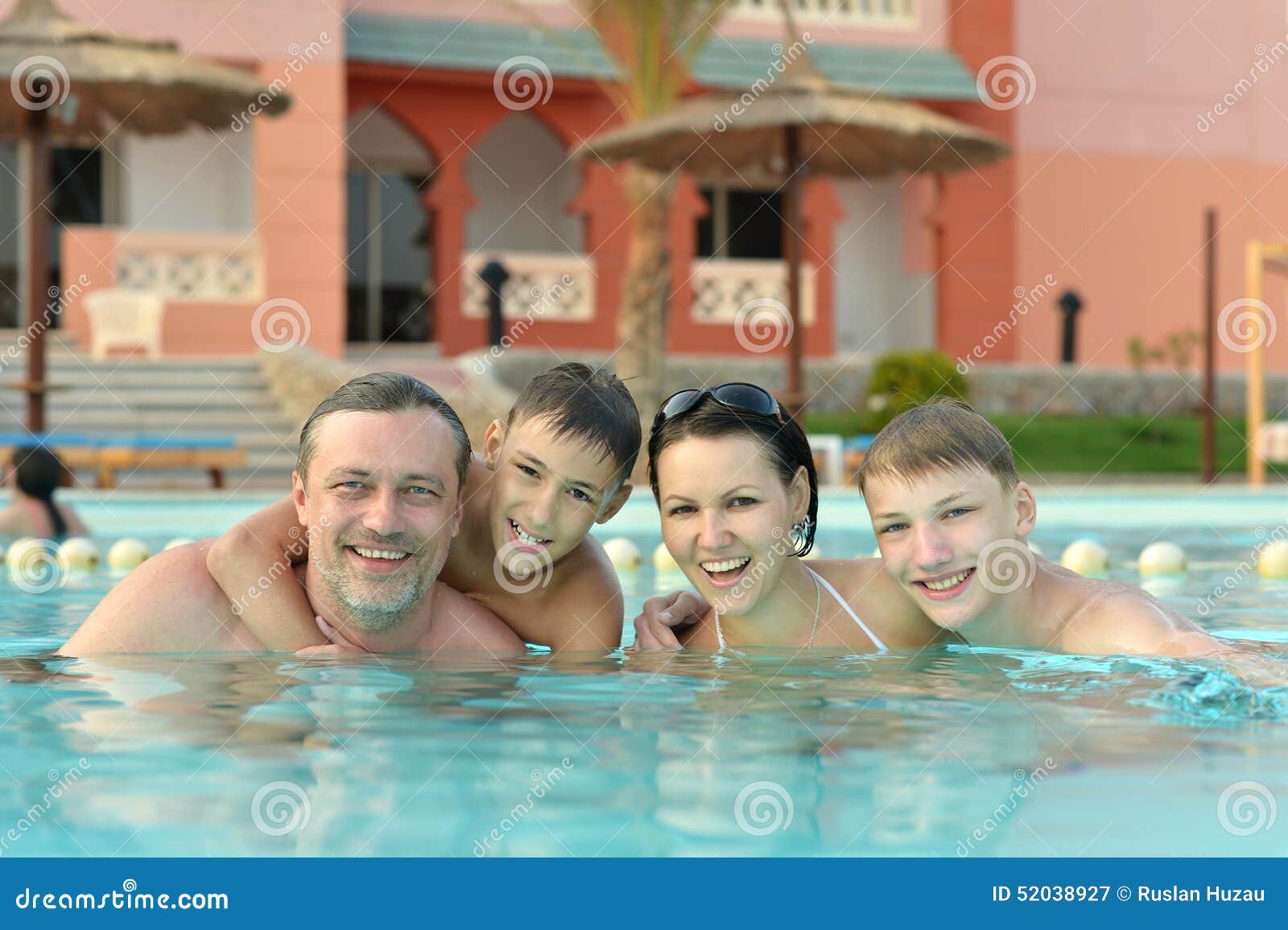 Family having fun in pool stock image. Image of outdoors - 52038927