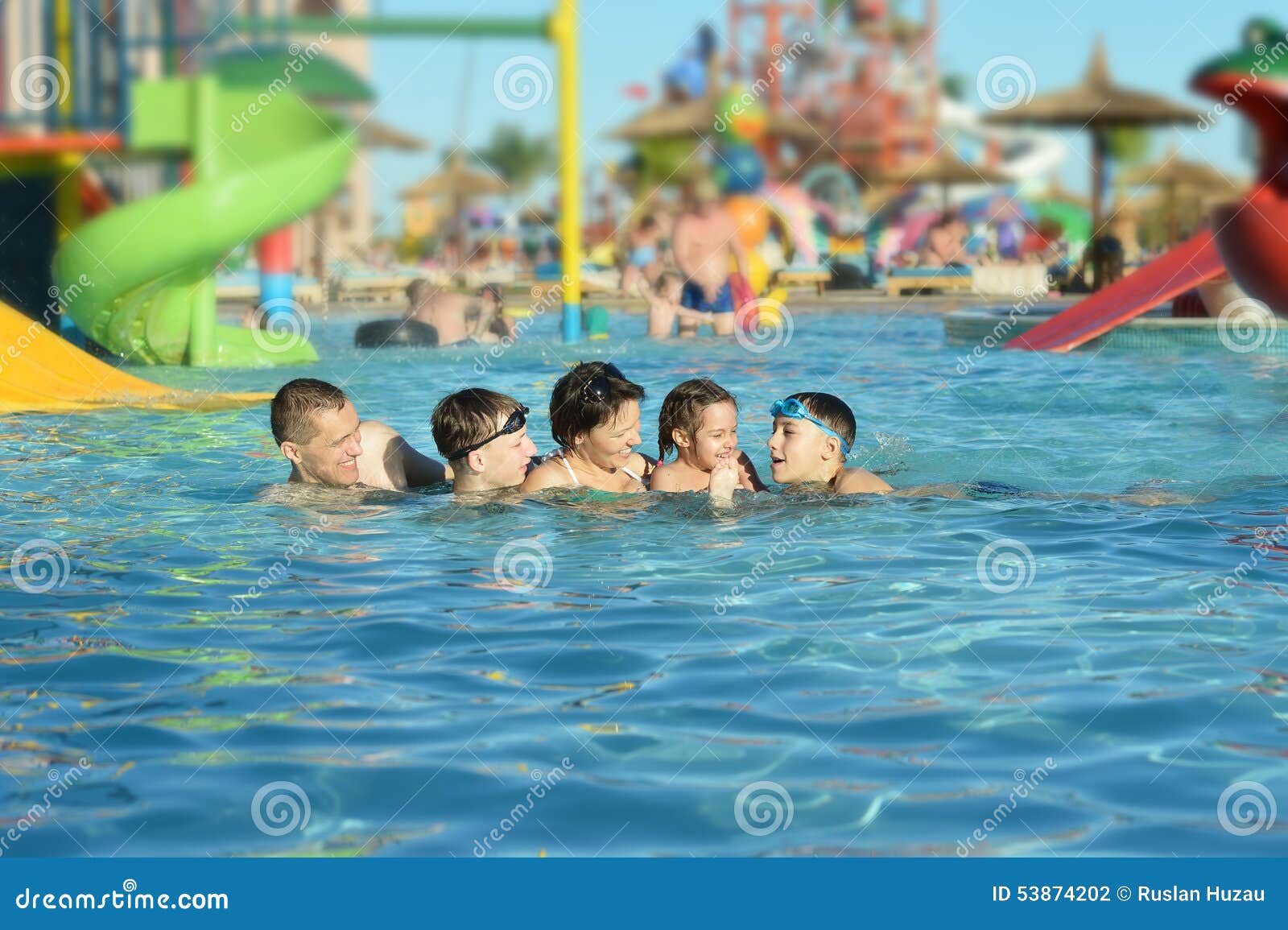 Family having fun in pool stock photo. Image of cheerful - 53874202