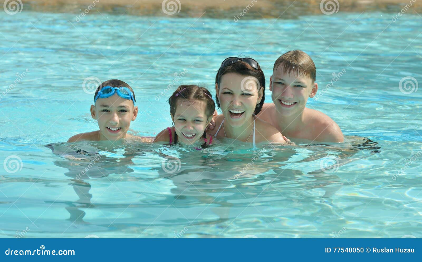 Family having fun in pool stock photo. Image of parent - 77540050
