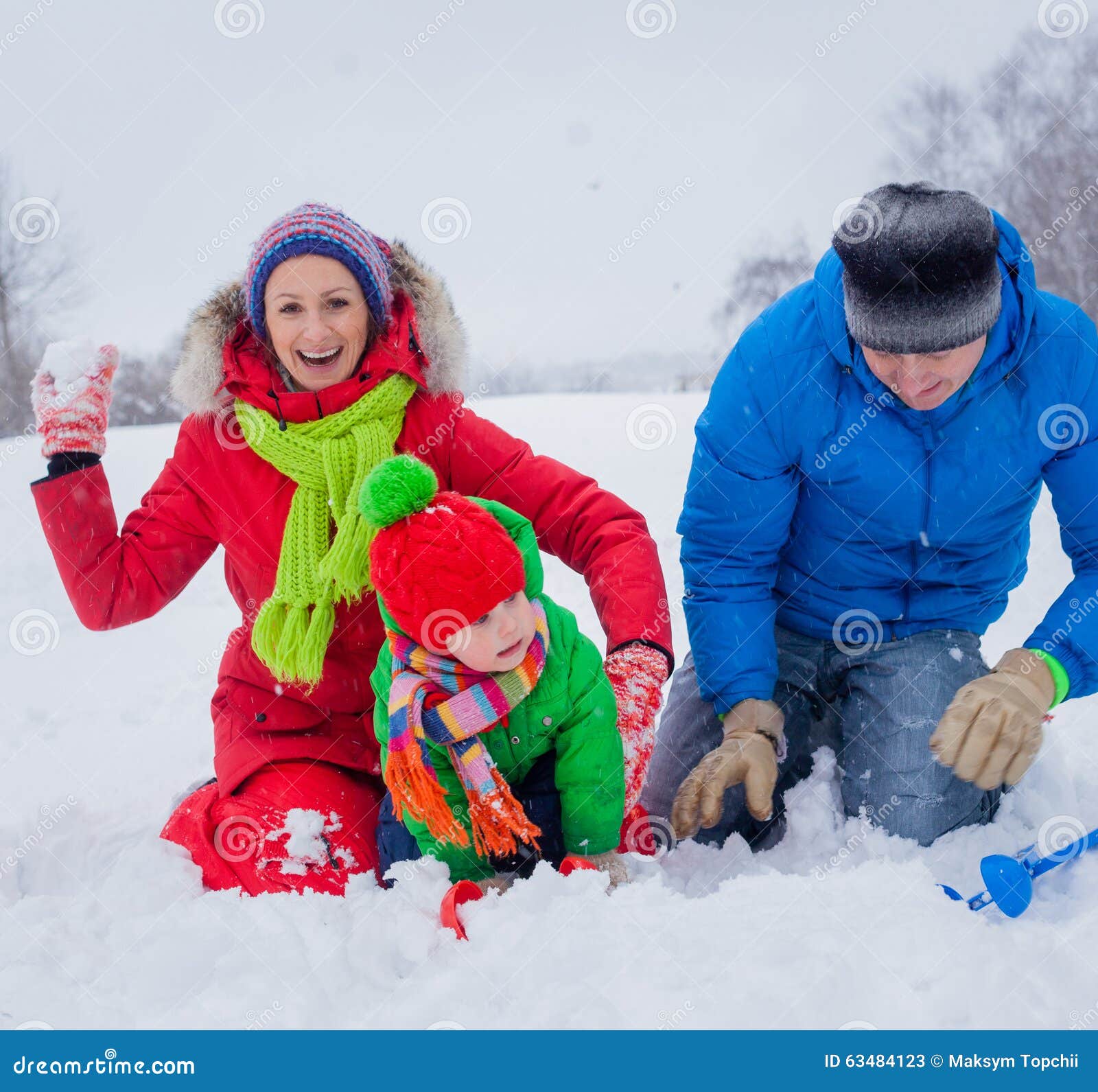 Family having fun in snow stock image. Image of little - 63484123