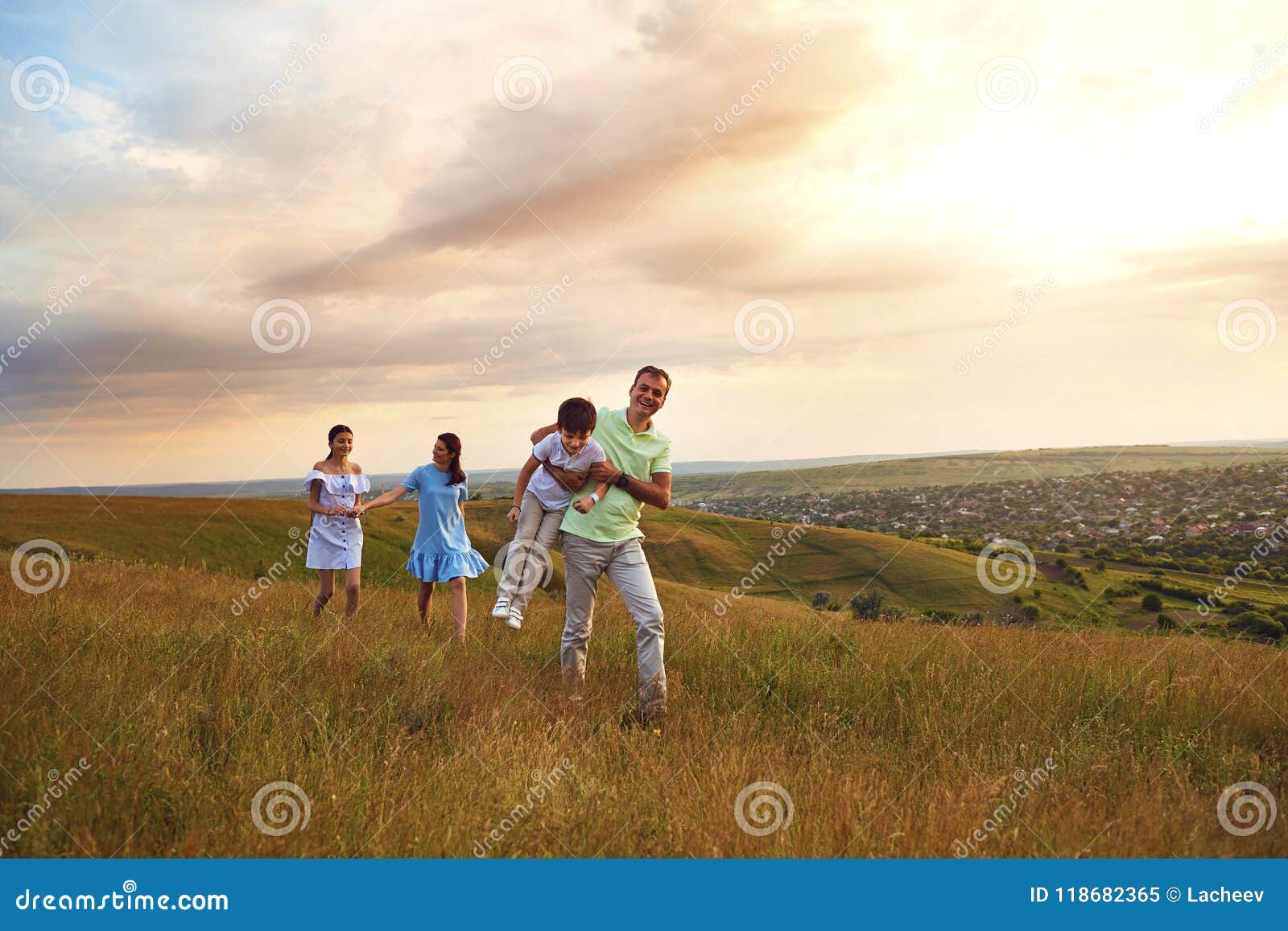A Family is Having Fun Walking in the Sunset Stock Image - Image of ...
