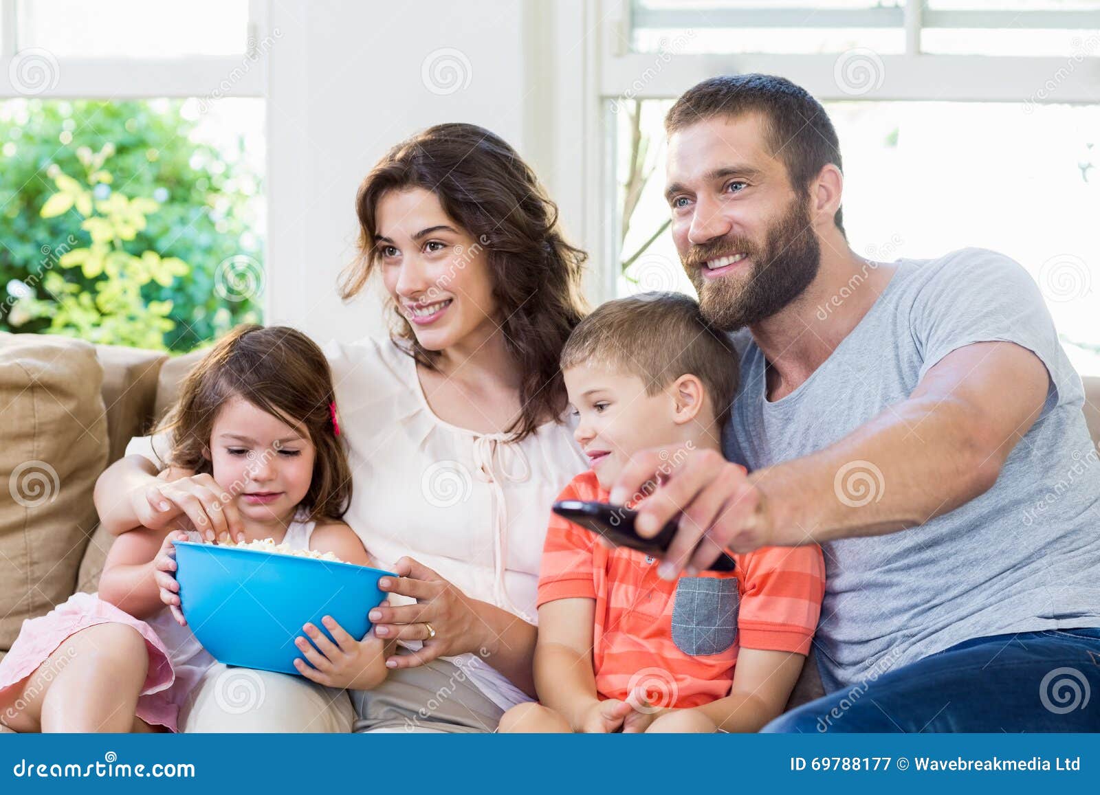 Family Having Fun while Watching Television Stock Image - Image of ...
