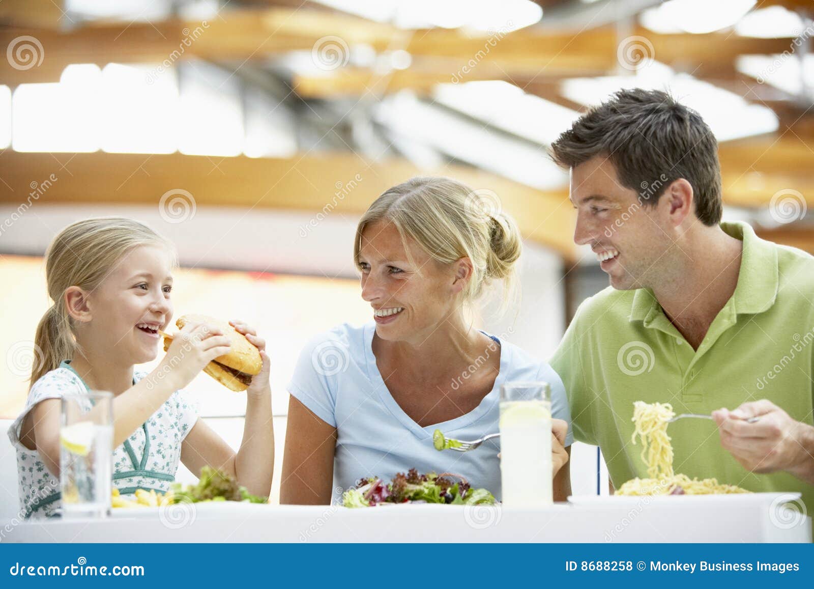 Family Having Lunch Together at the Mall Stock Photo - Image of father ...