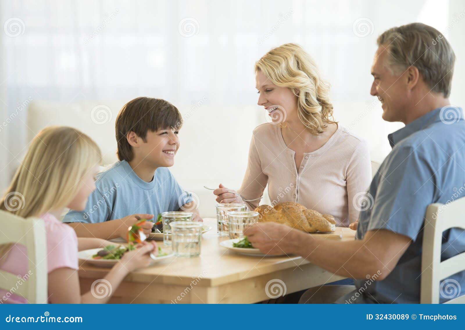 Family Having Meal at Dining Table Stock Image - Image of food, chair ...