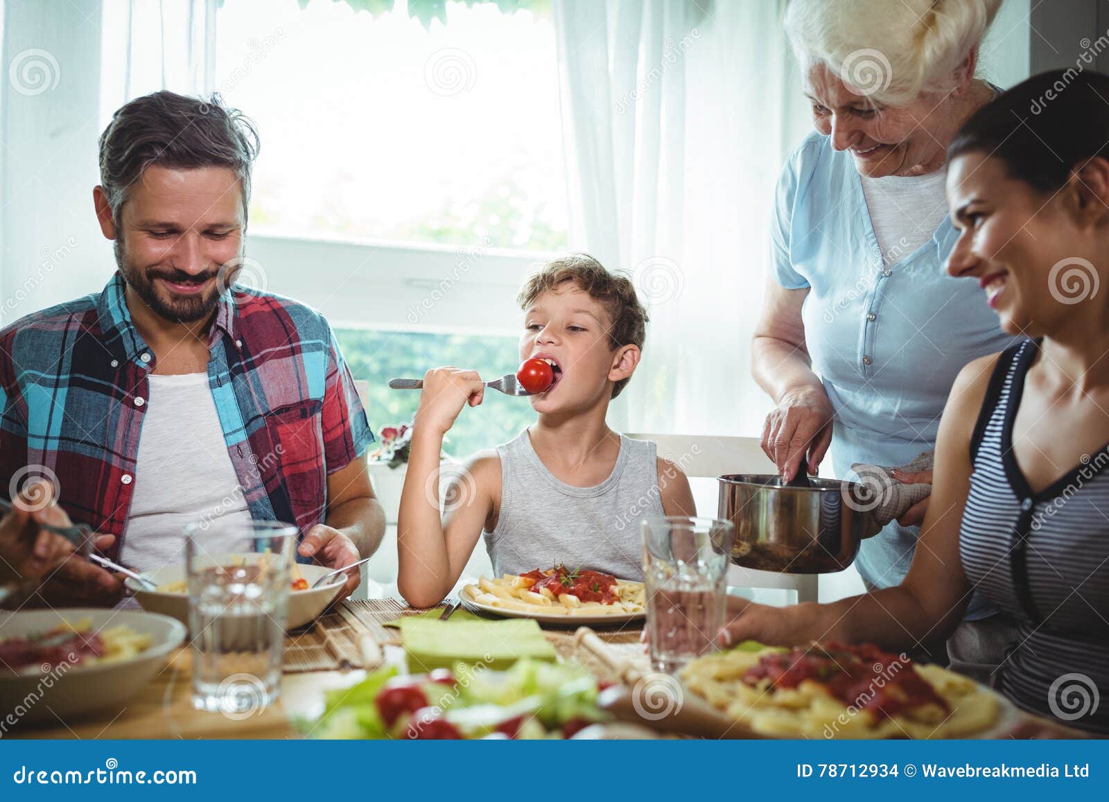 Family Having Meal Together Stock Photo - Image of care, father: 78712934