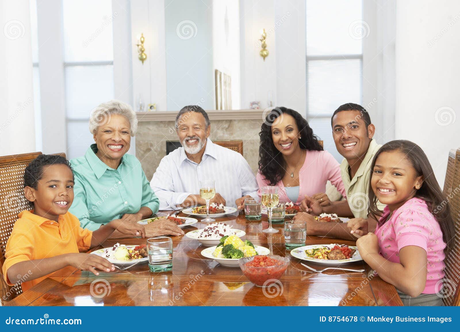 Family Having a Meal Together at Home Stock Photo - Image of meal, kids ...