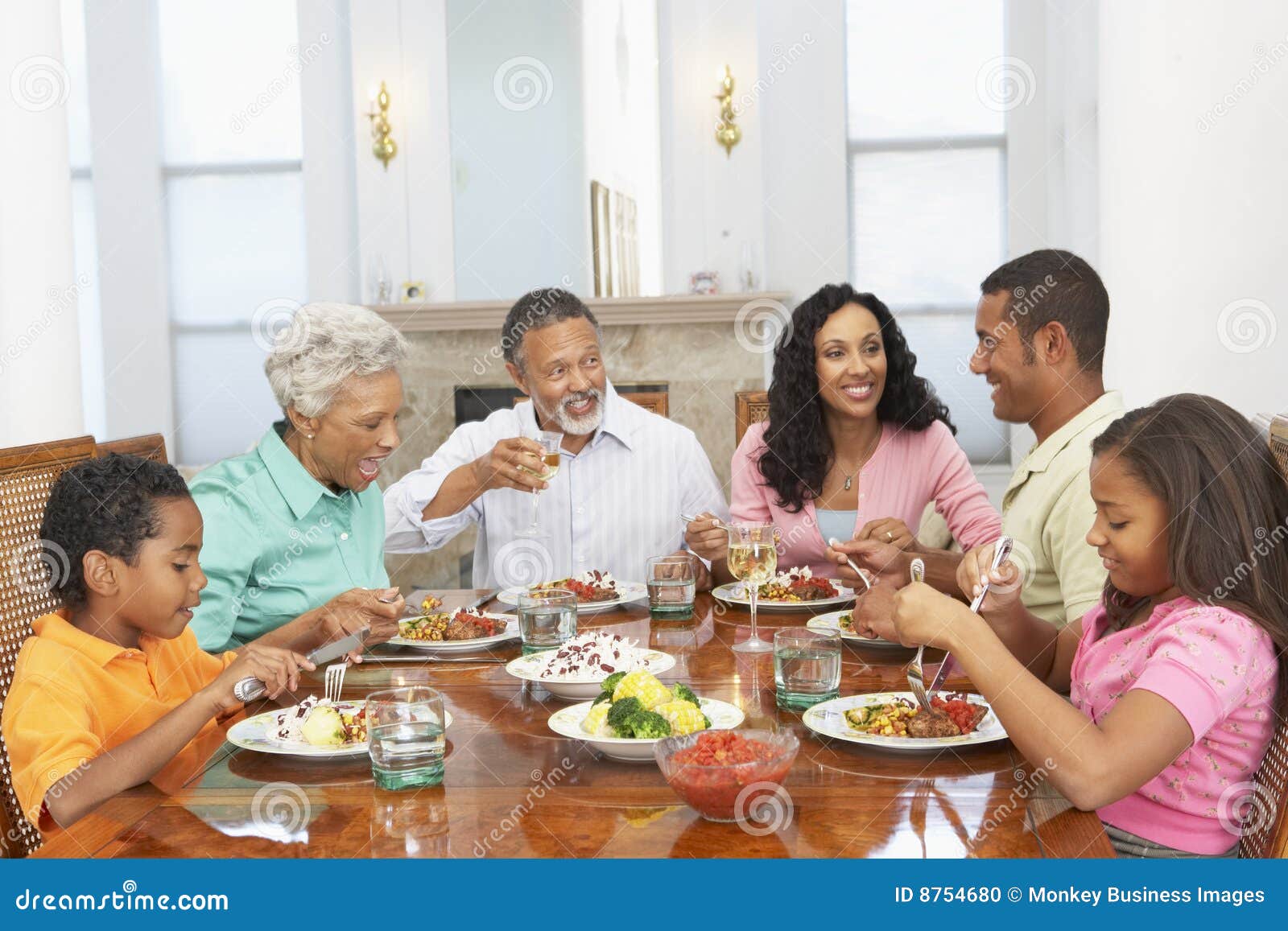 Family Having a Meal Together at Home Stock Photo - Image of father ...