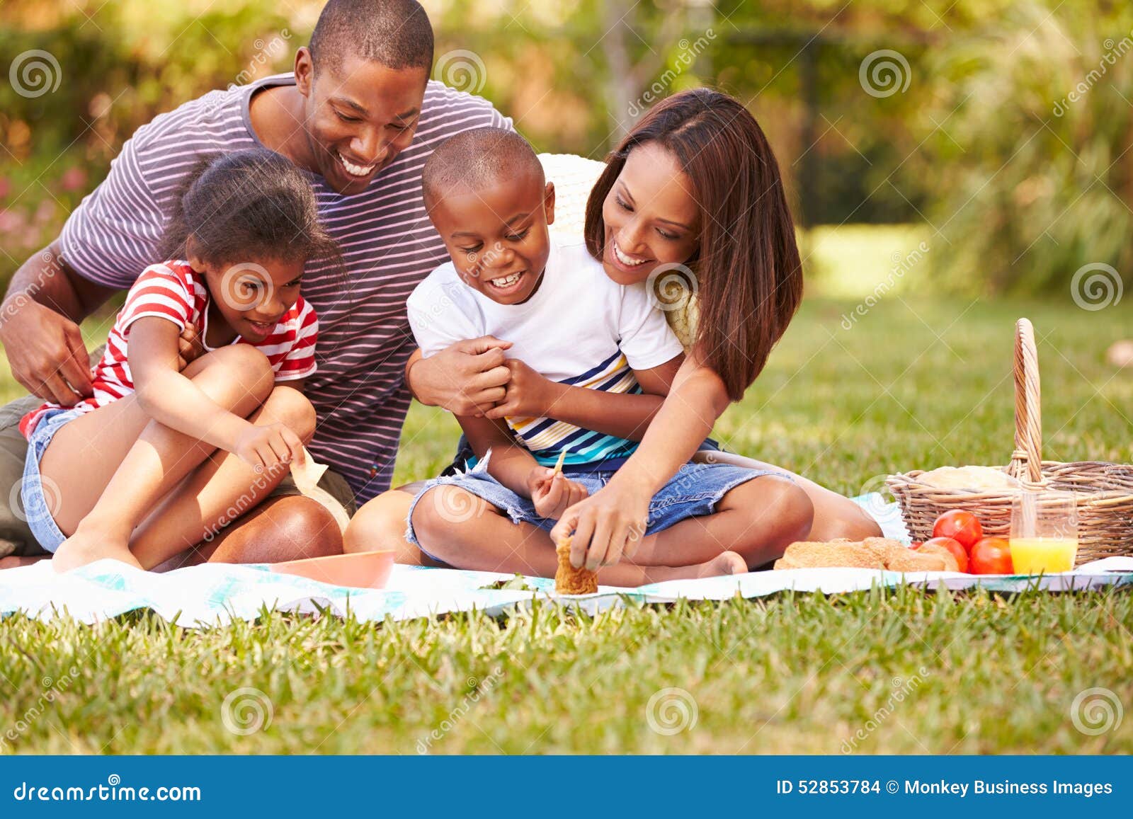 Family Having Picnic in Garden Together Stock Photo - Image of black ...
