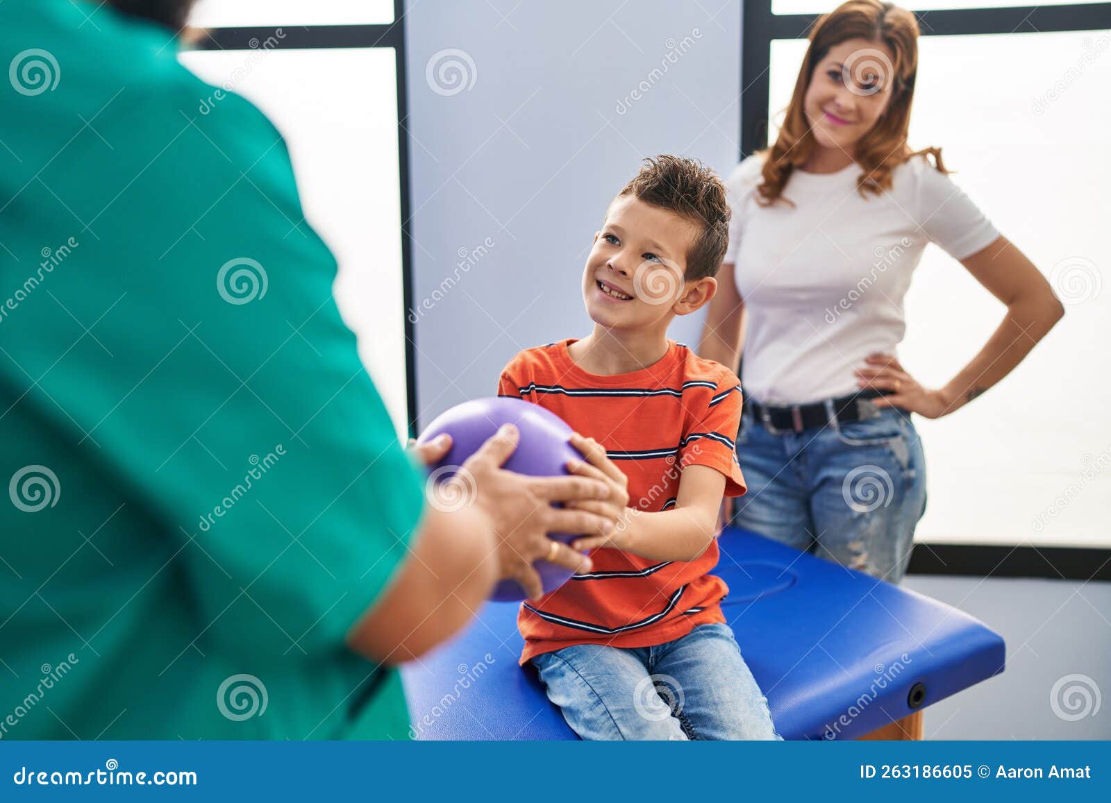 Family Having Rehab Session Using Ball at Rehab Clinic Stock Image ...