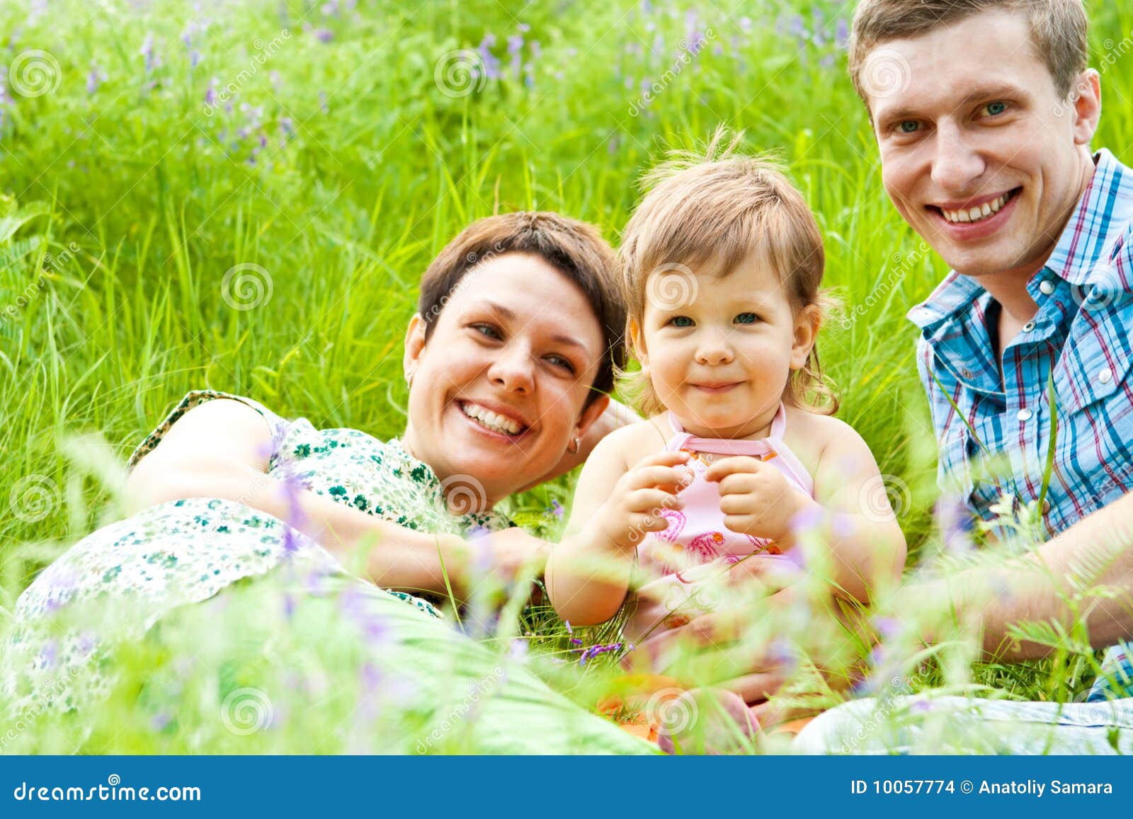 Family Having Rest in the Meadow Stock Photo - Image of family, human ...