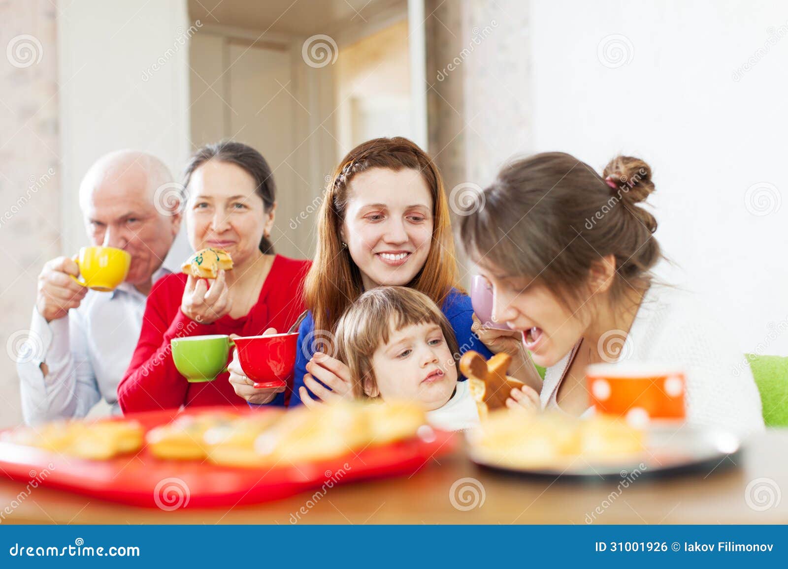 Family Having Tea with Cakes Stock Photo - Image of parent, group: 31001926
