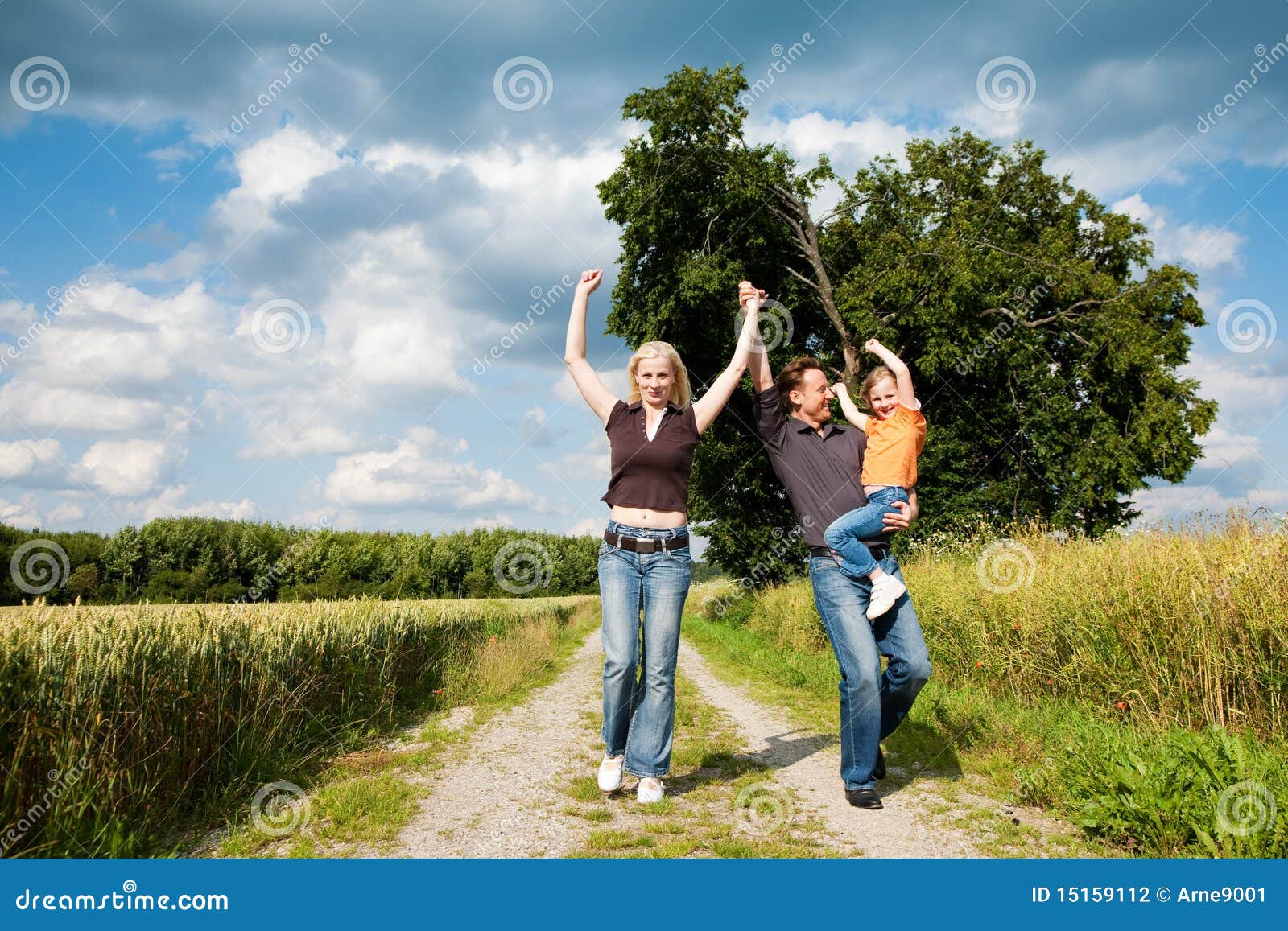Family Having a Walk Carrying Child Stock Photo - Image of laughing ...