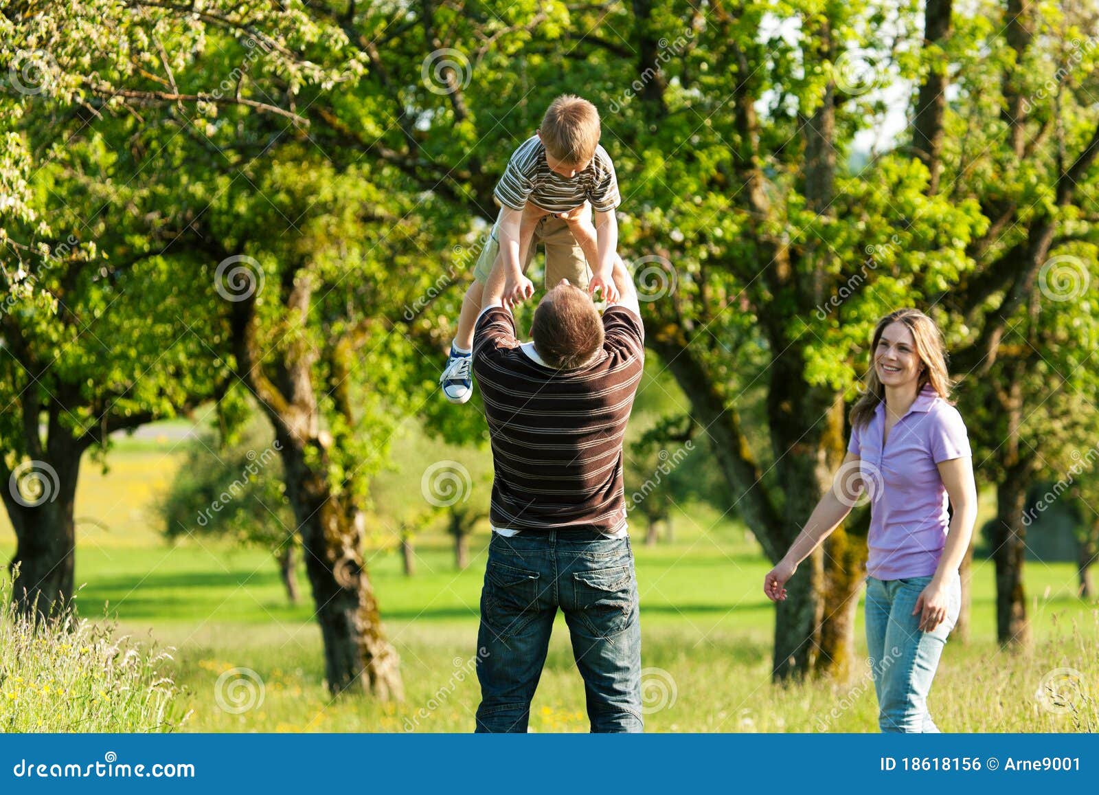 Family Having a Walk Outdoors in Summer Stock Photo - Image of running ...