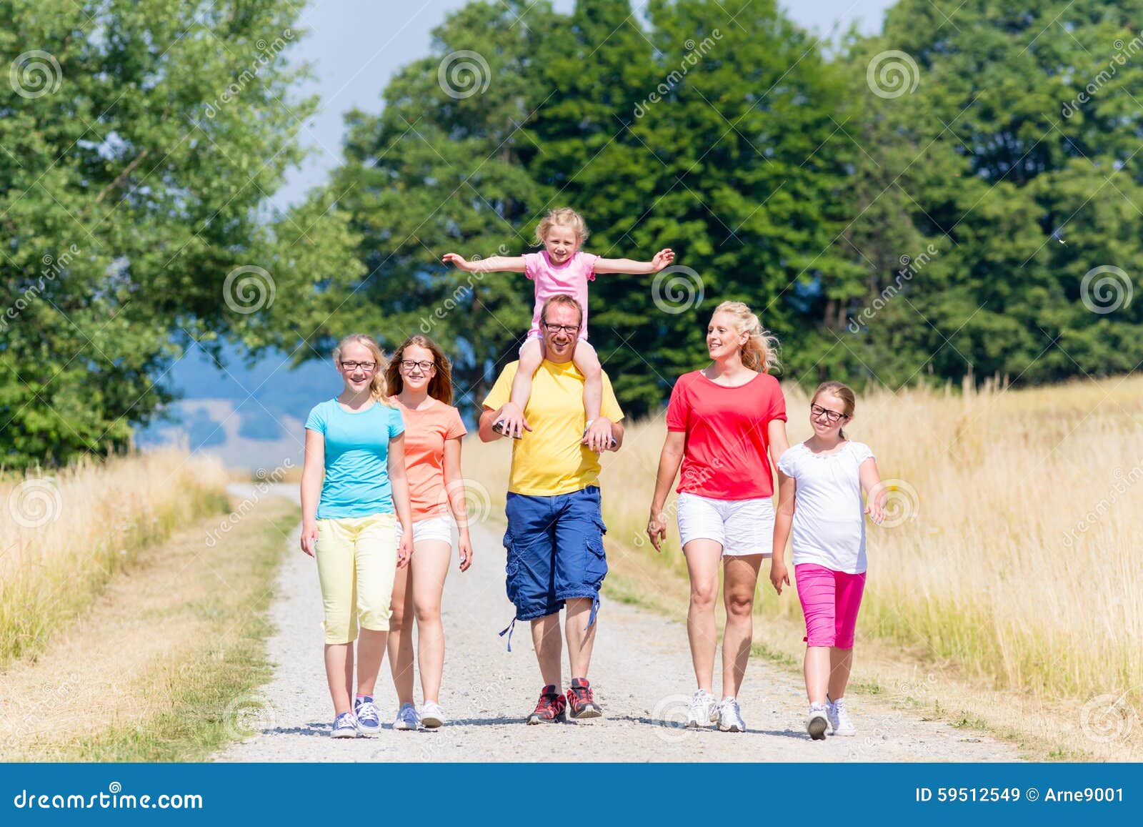 Family Having Walk on Path in Summer Stock Image - Image of father ...