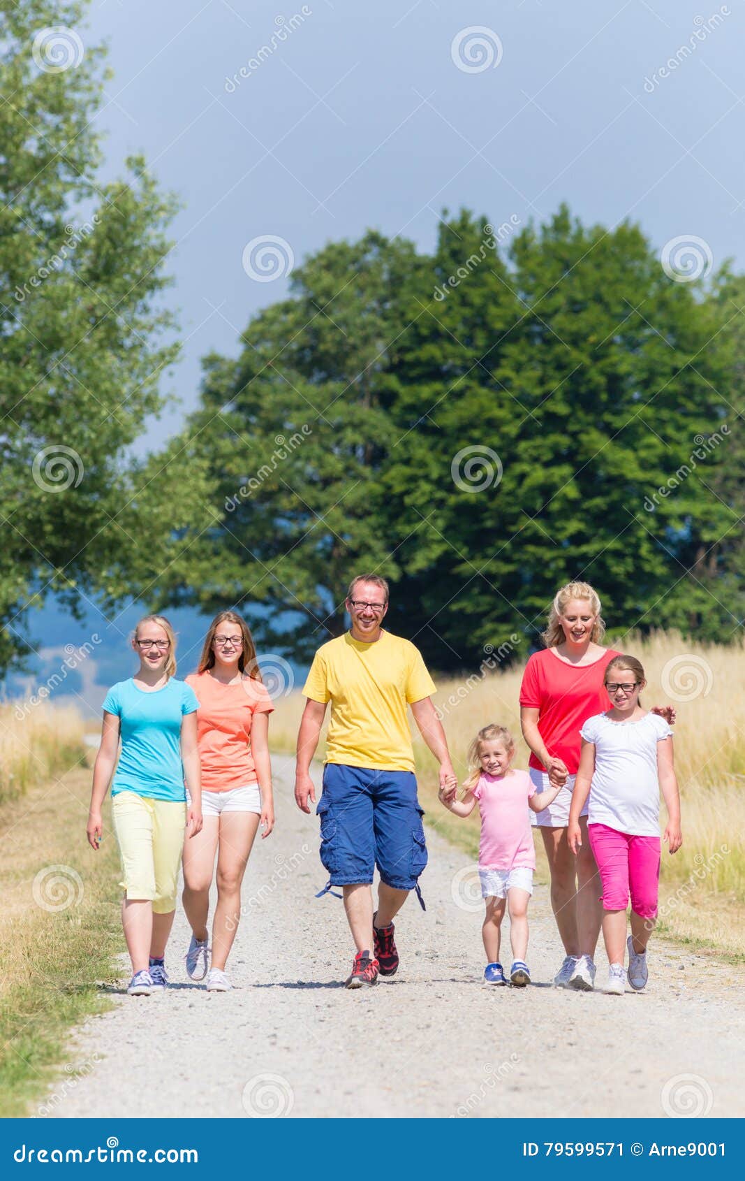 Family Having Walk on Path in the Woods Stock Image - Image of smiling ...