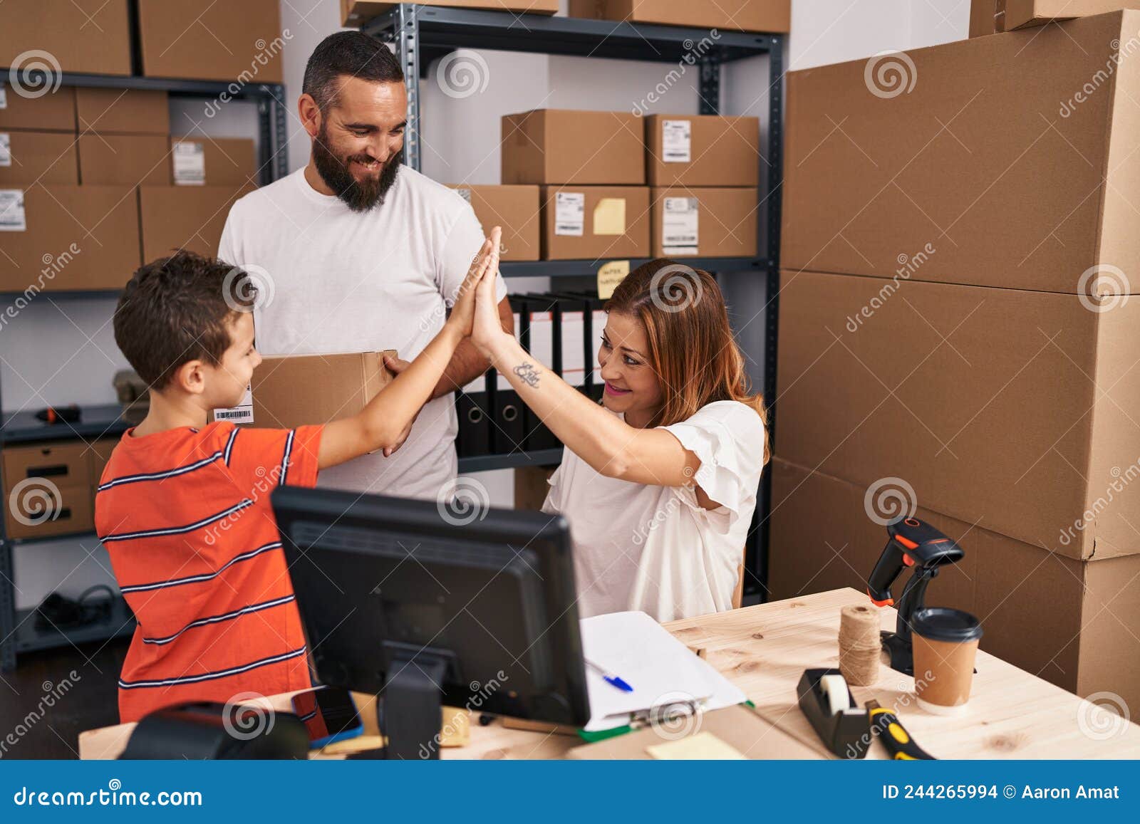 Family High Five with Hands Raised Up Working at Storehouse Stock Photo ...