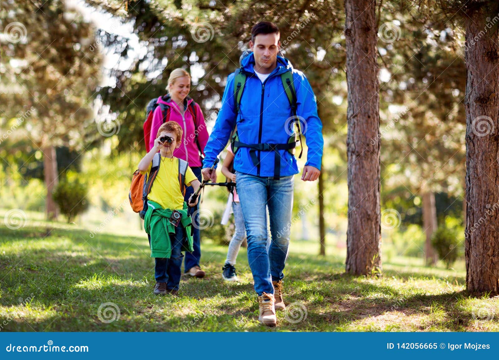 Family on a hiking day stock image. Image of nature - 142056665