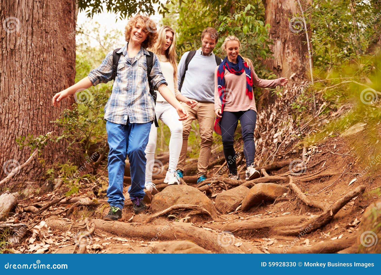 Family Hiking through a Forest Stock Photo - Image of caucasian, family ...